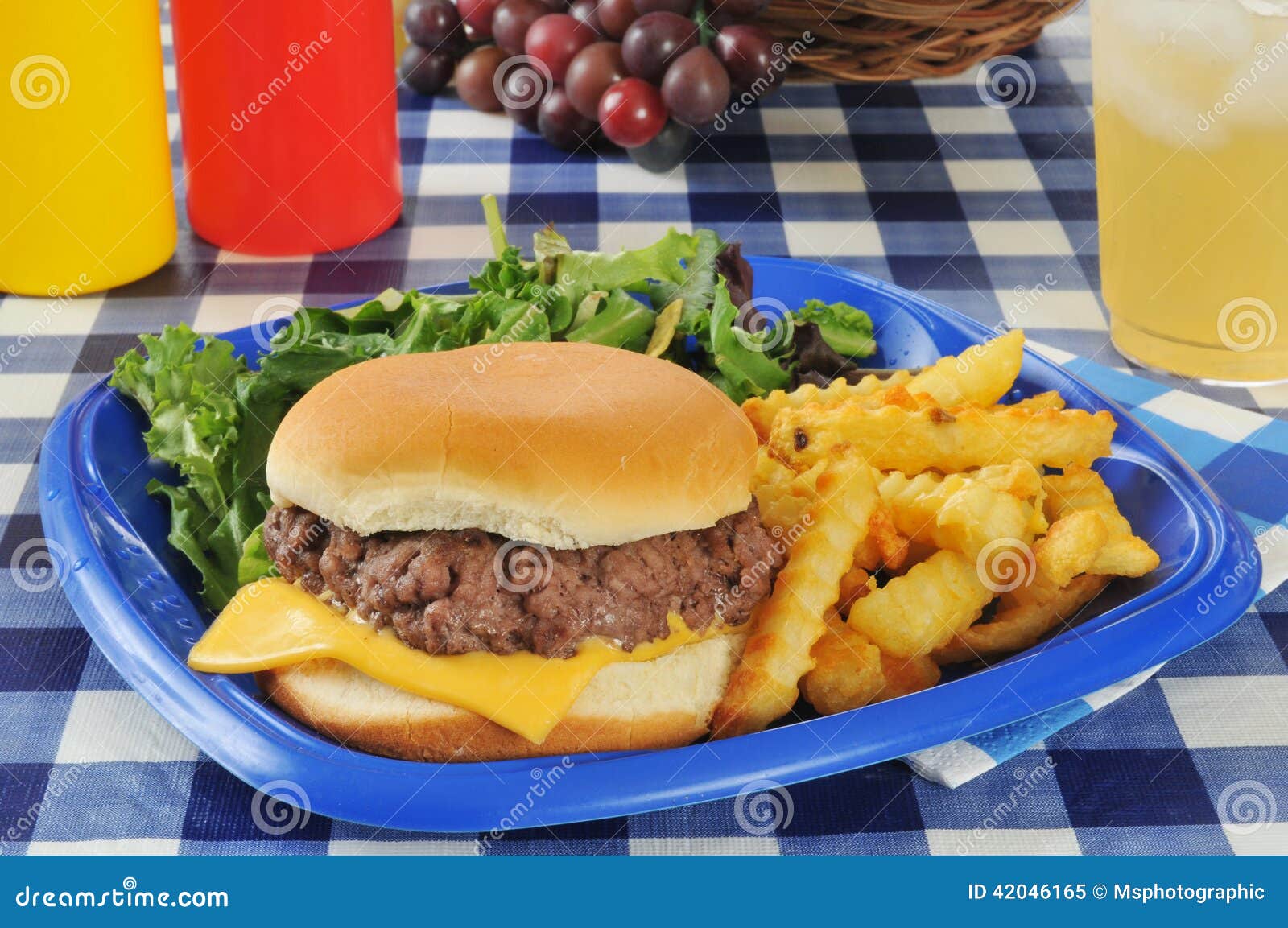 Cheeseburger with Fries on a Picnic Table Stock Image - Image of ...