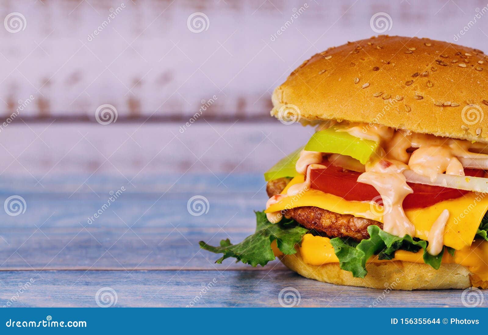 Cheeseburger with Melted Cheese on a White Table Stock Photo - Image of ...