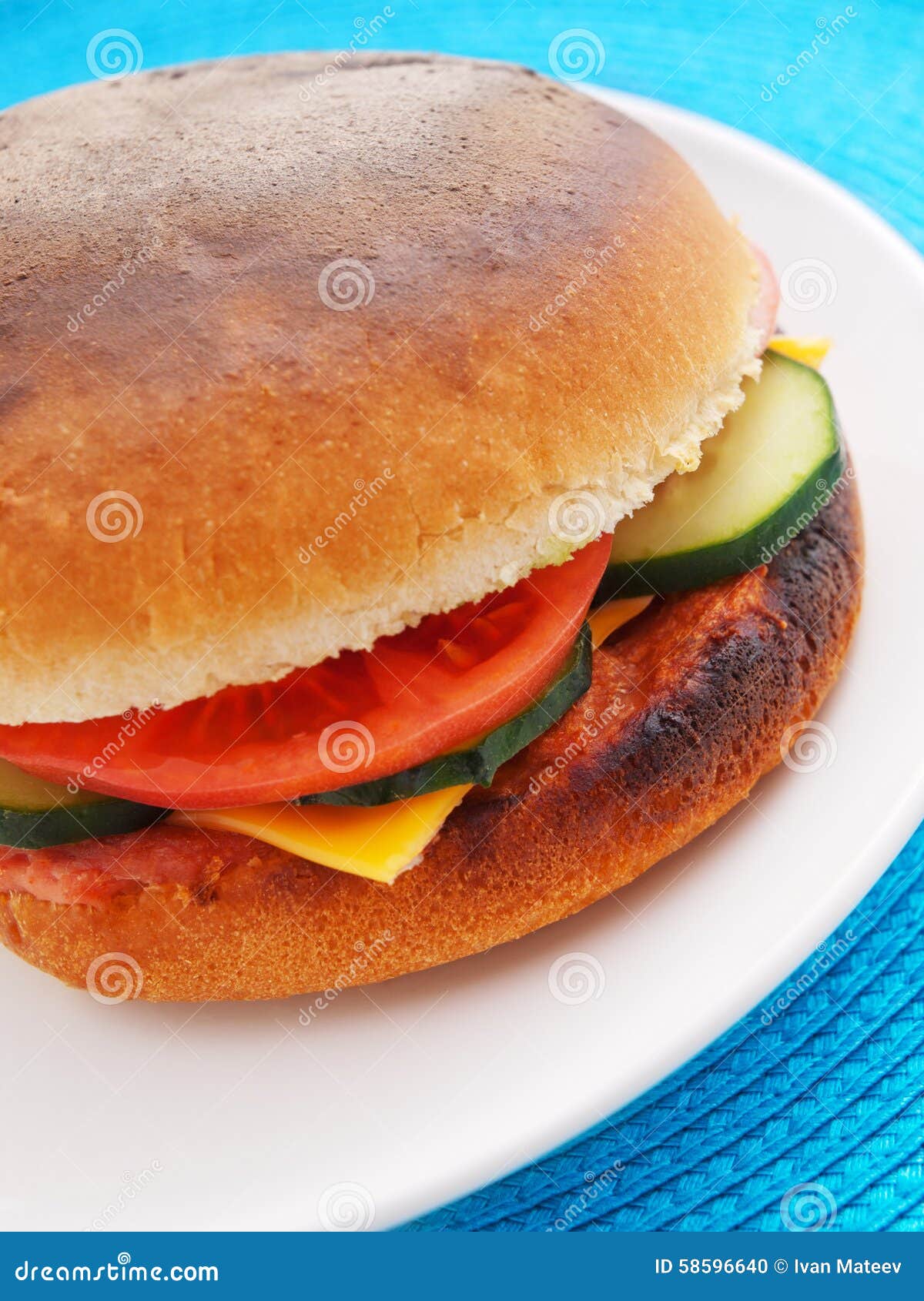 Cheeseburger with Tomato and Cucumber Stock Photo - Image of cheese ...