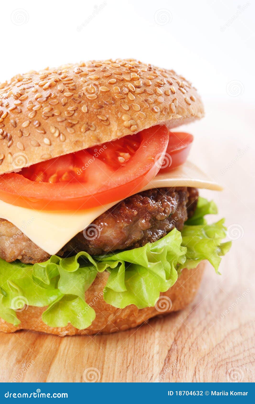 Cheeseburger with Tomatoes and Lettuce Stock Photo - Image of bread ...