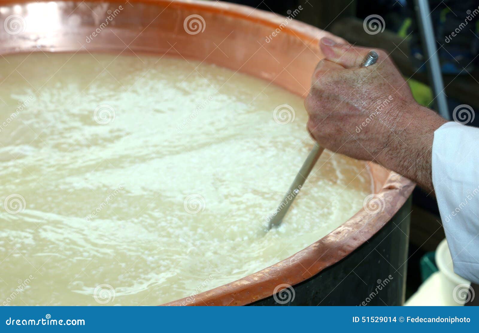 CHEESEMAKER Mixes the Milk in Copper Pot for Chee Stock Photo - Image ...