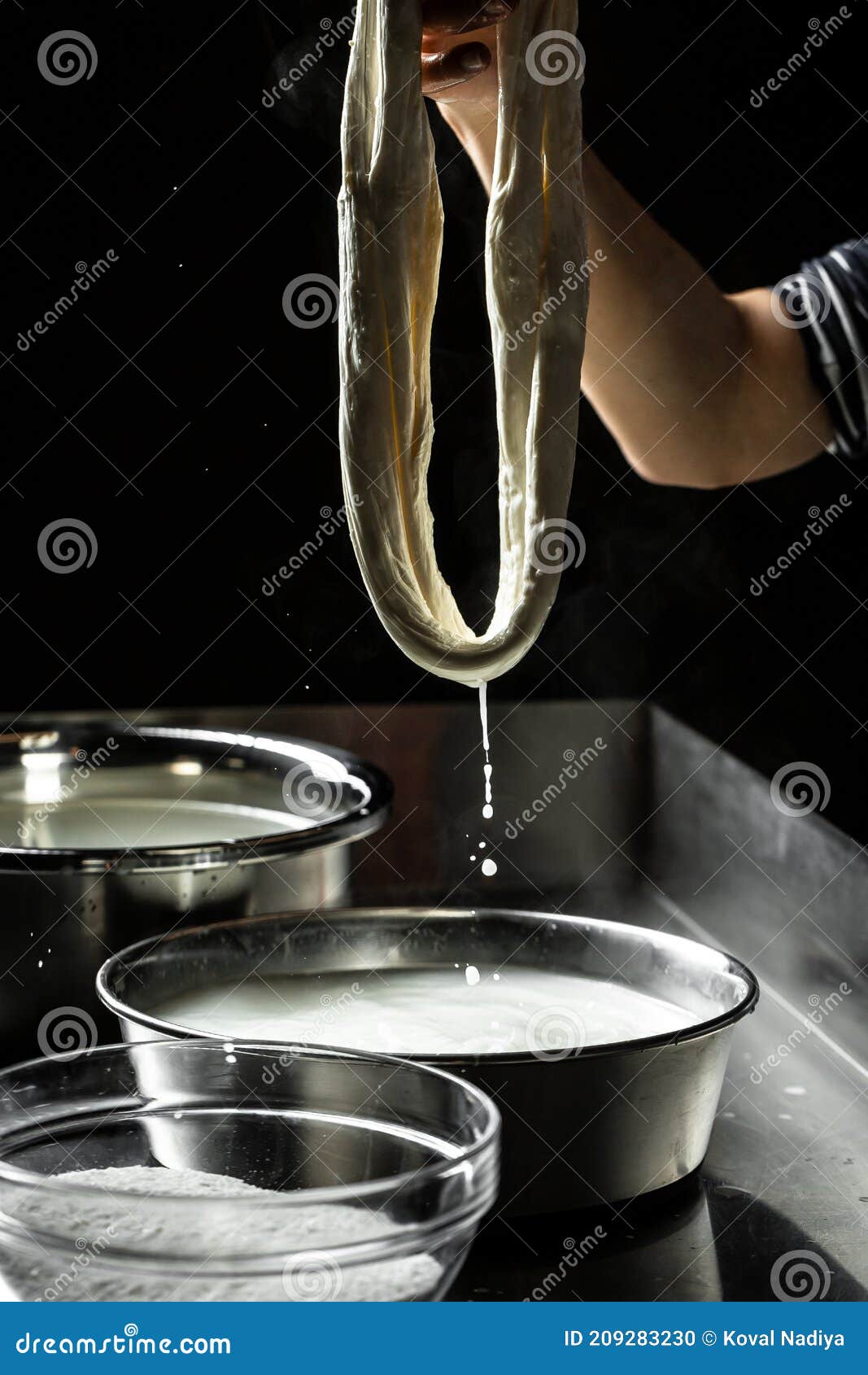 A Cheesemaker Prepares A Form Of Parmesan Cheese Using Fresh Curd ... A Cheesemaker Prepares A Form Of Parmesan Cheese Using Fresh Curd ...