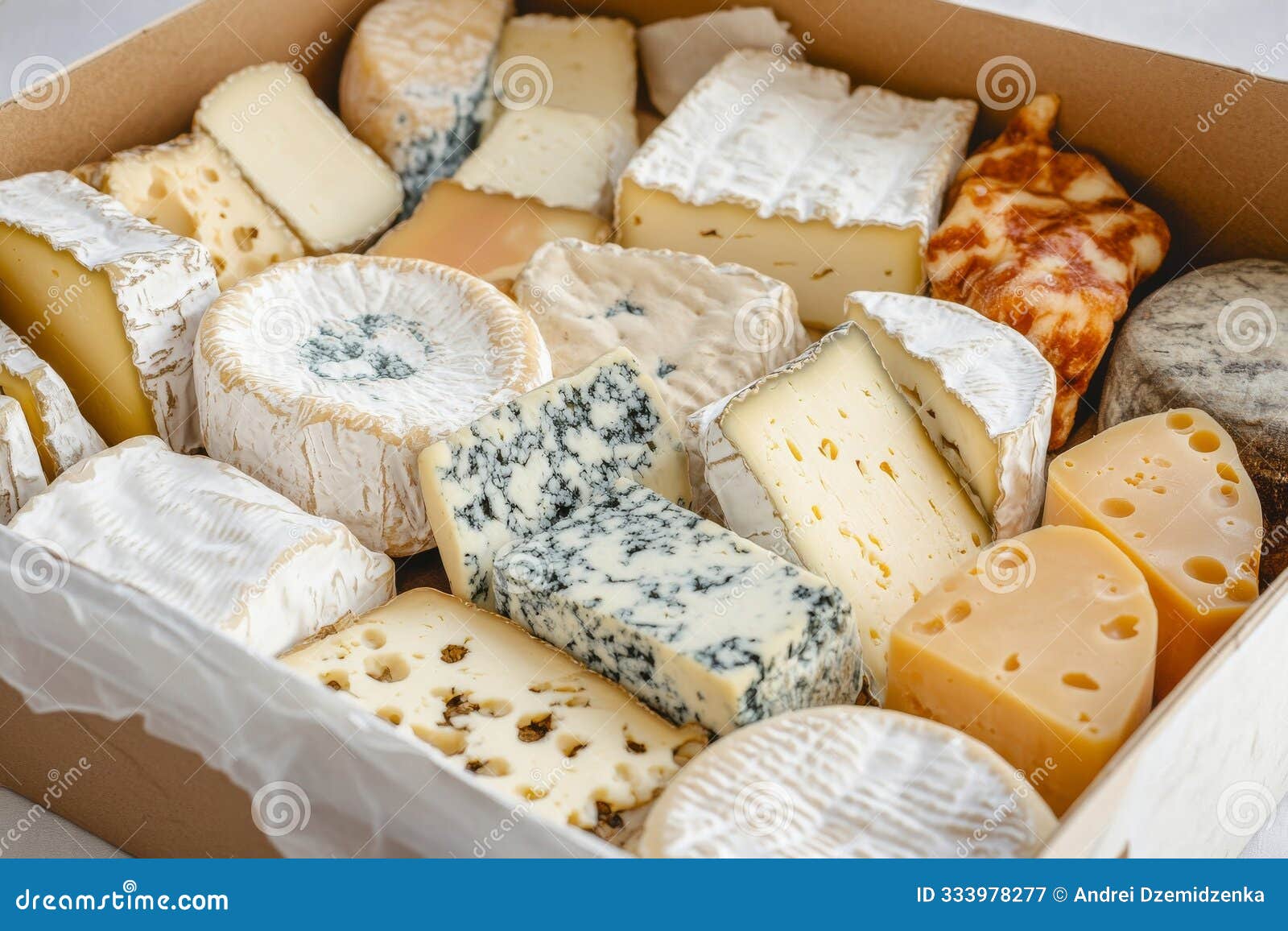 Cheeses Such As Blue Cheese, Brie, and Cheddar are Shown in a Box ...