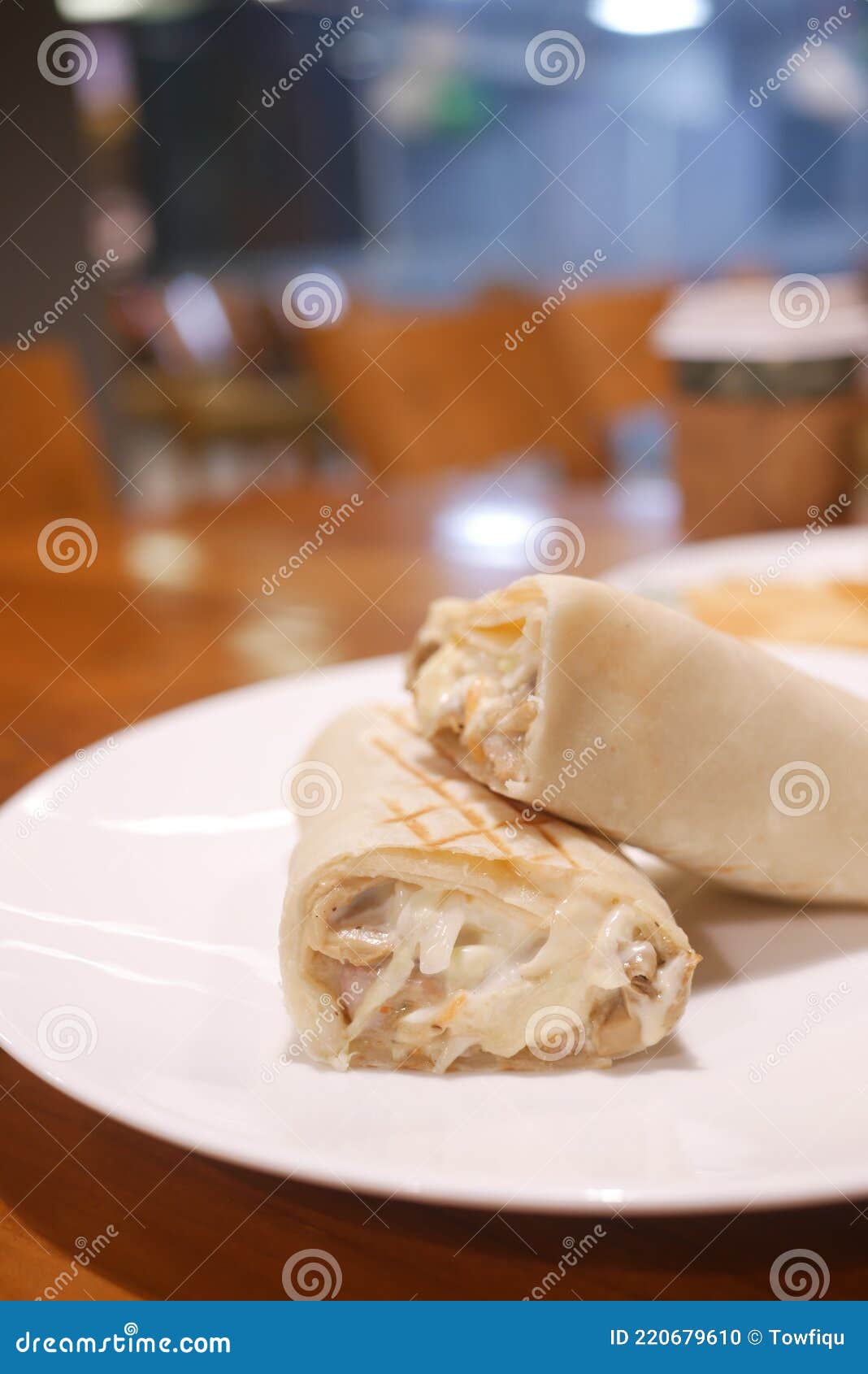 Cheesy Chicken Warp on Cafe Table , Stock Photo - Image of mexican ...