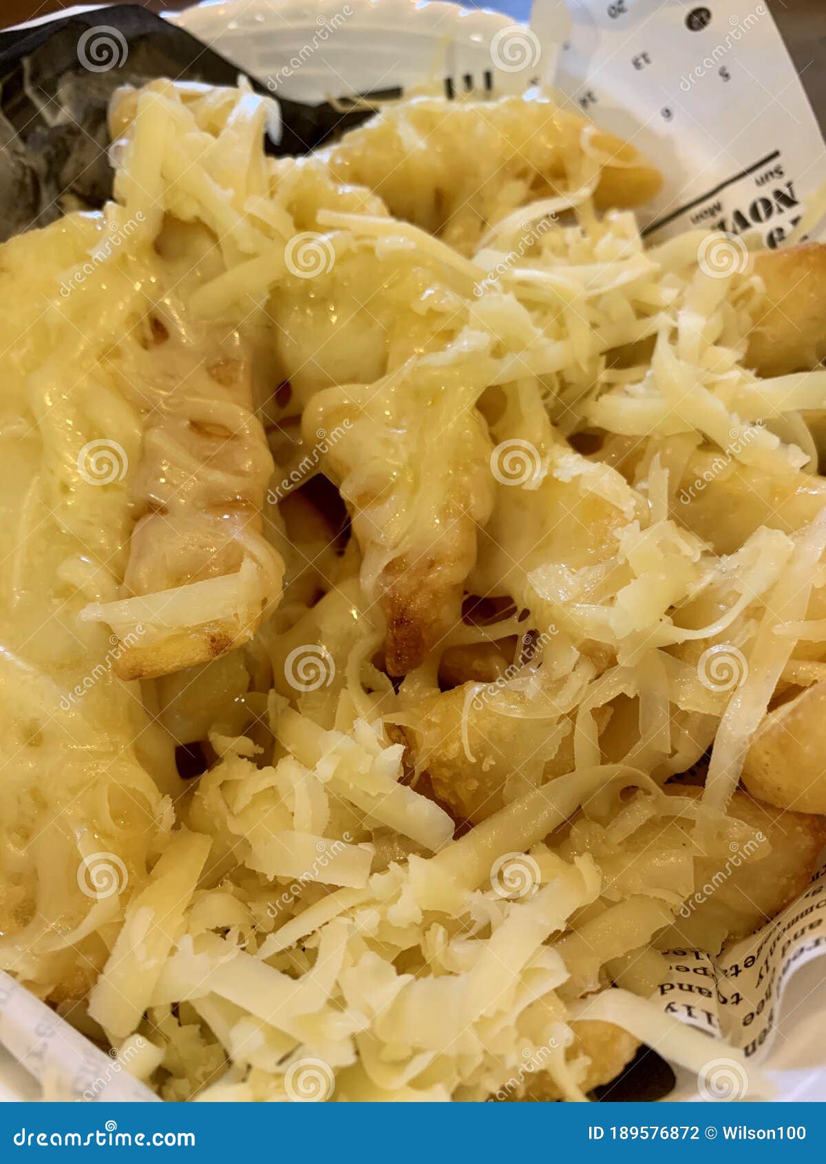 Cheesy chips stock photo. Image of portion, dinner, paper - 189576872
