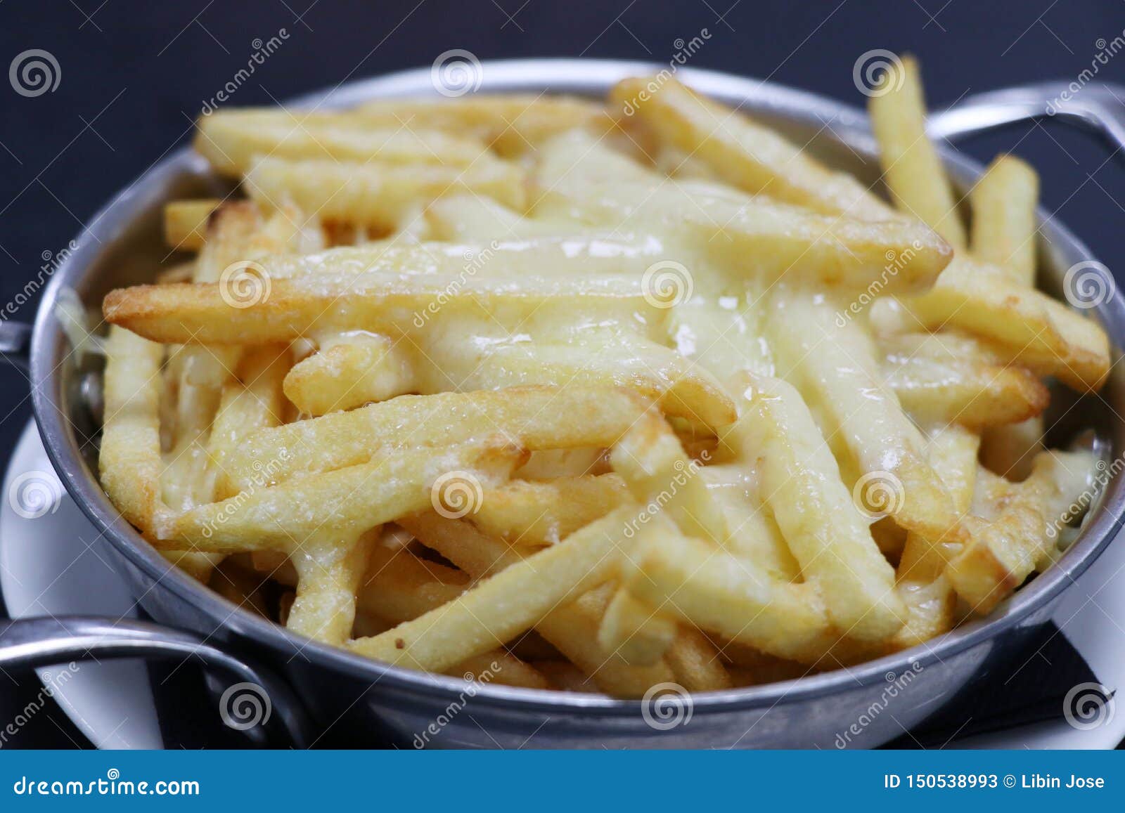 Cheesy french fries stock image. Image of appetizer - 150538993