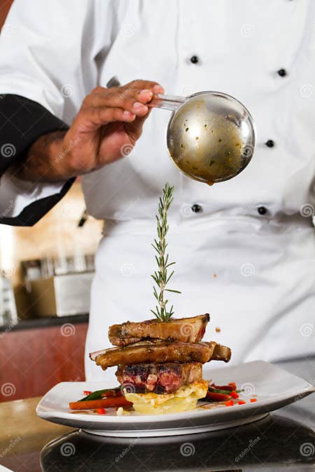 Chef add sauce stock image. Image of male, kitchen, cooking - 14985445