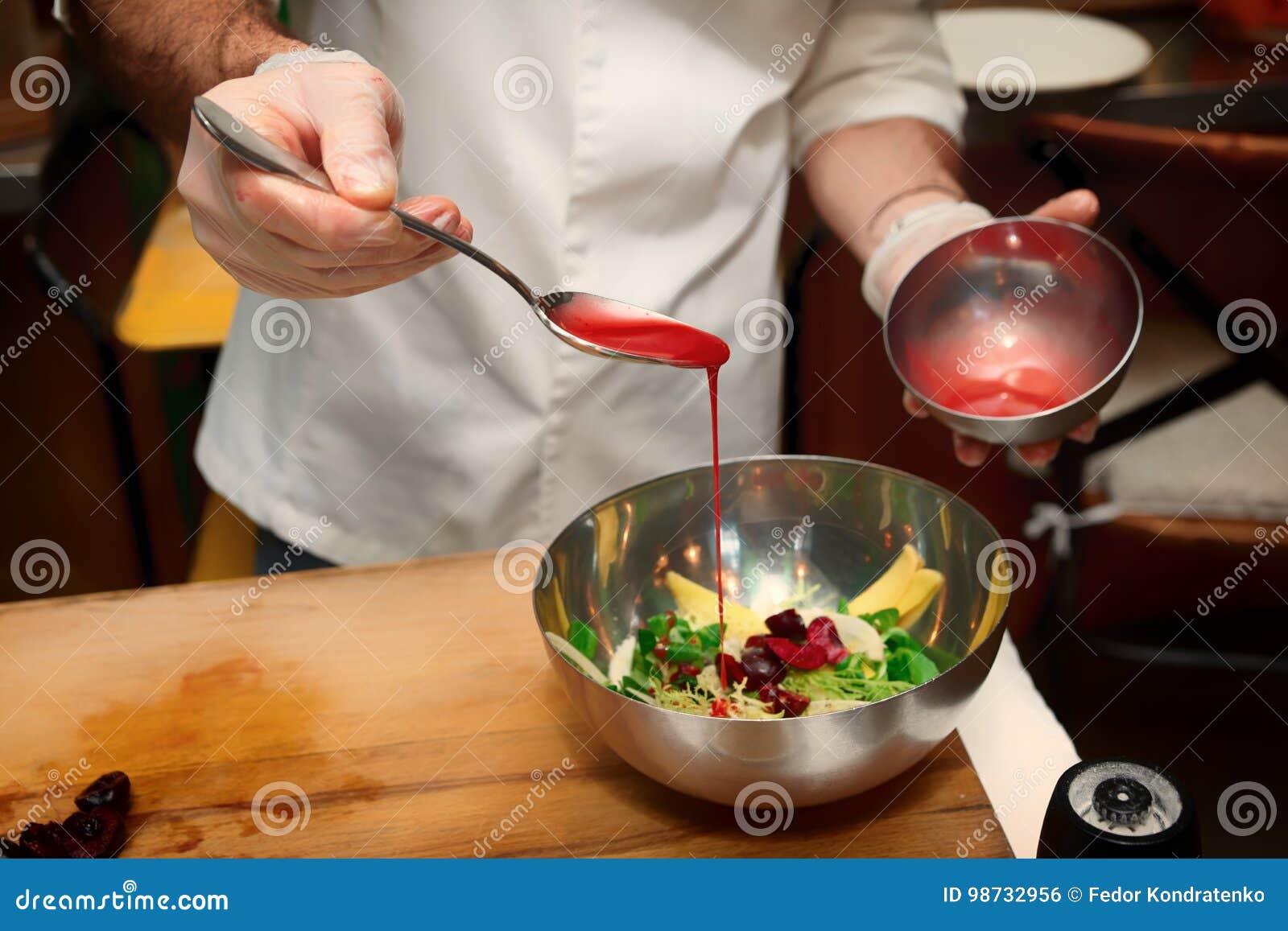 Chef is Adding Sauce To Bowl with Vegetable Appetizer, Toned Stock ...
