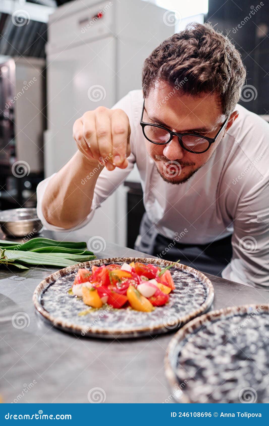Chef Adding Spices in Salad Stock Photo - Image of chef, concentration ...