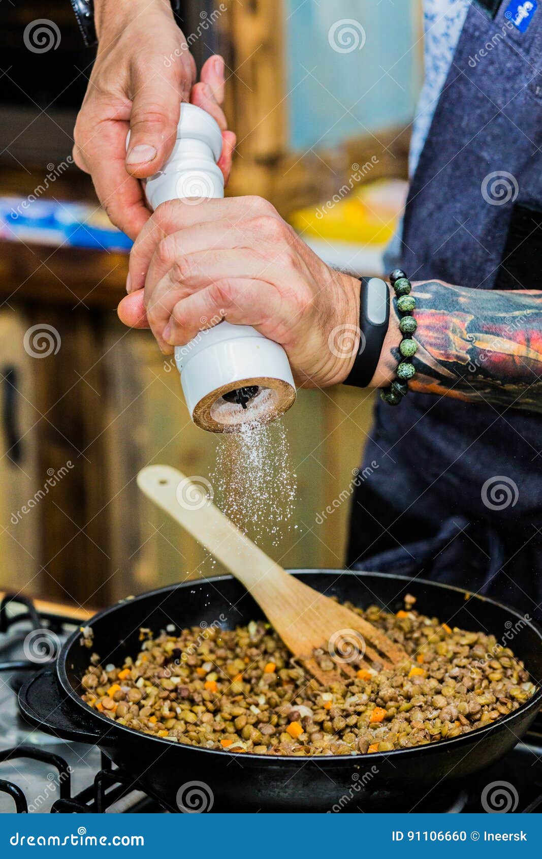 Chef Adds Ingredients To Meals Stock Photo - Image of commercial ...