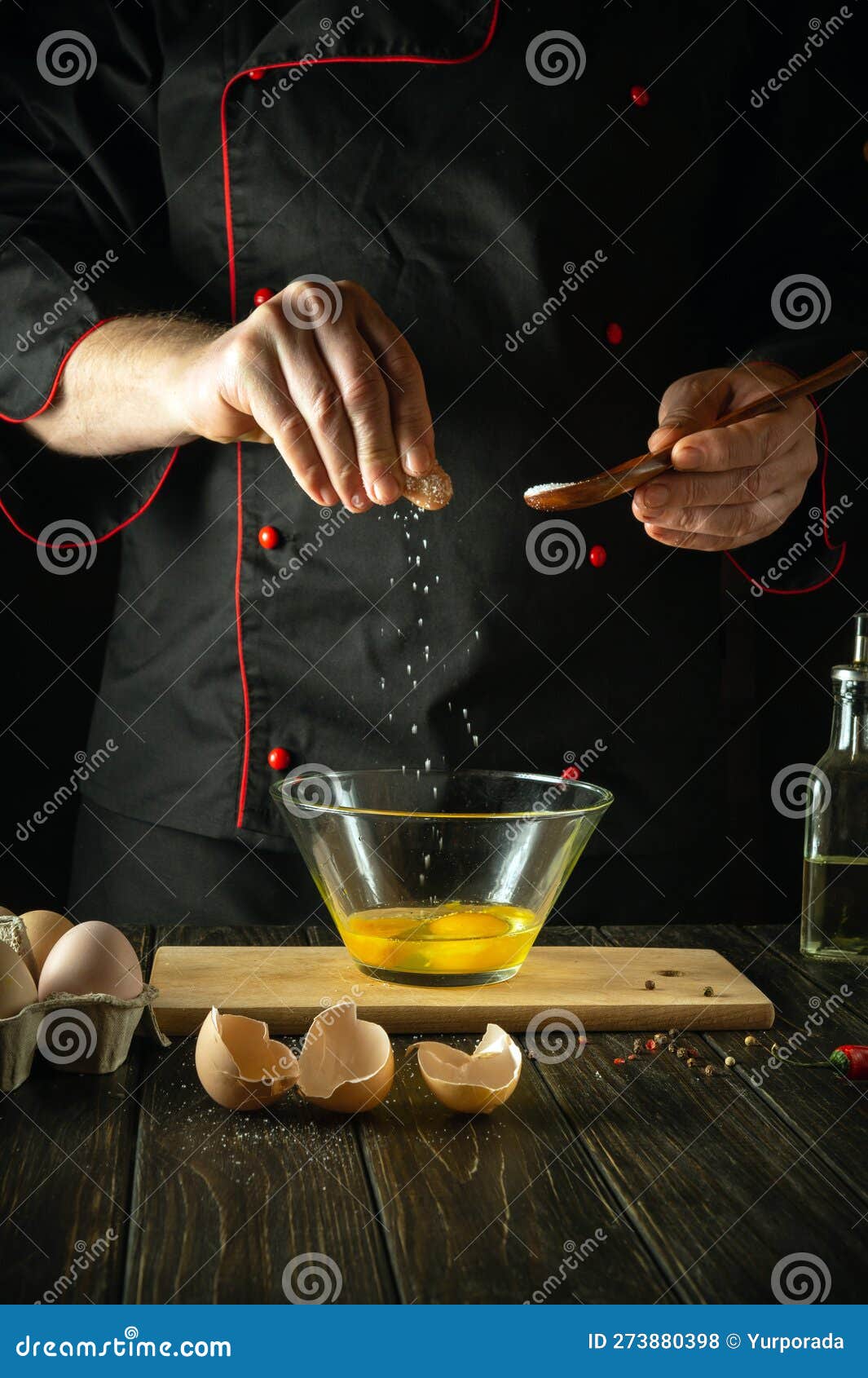 The Chef Adds Salt while Cooking the Eggs. Work Environment on the ...