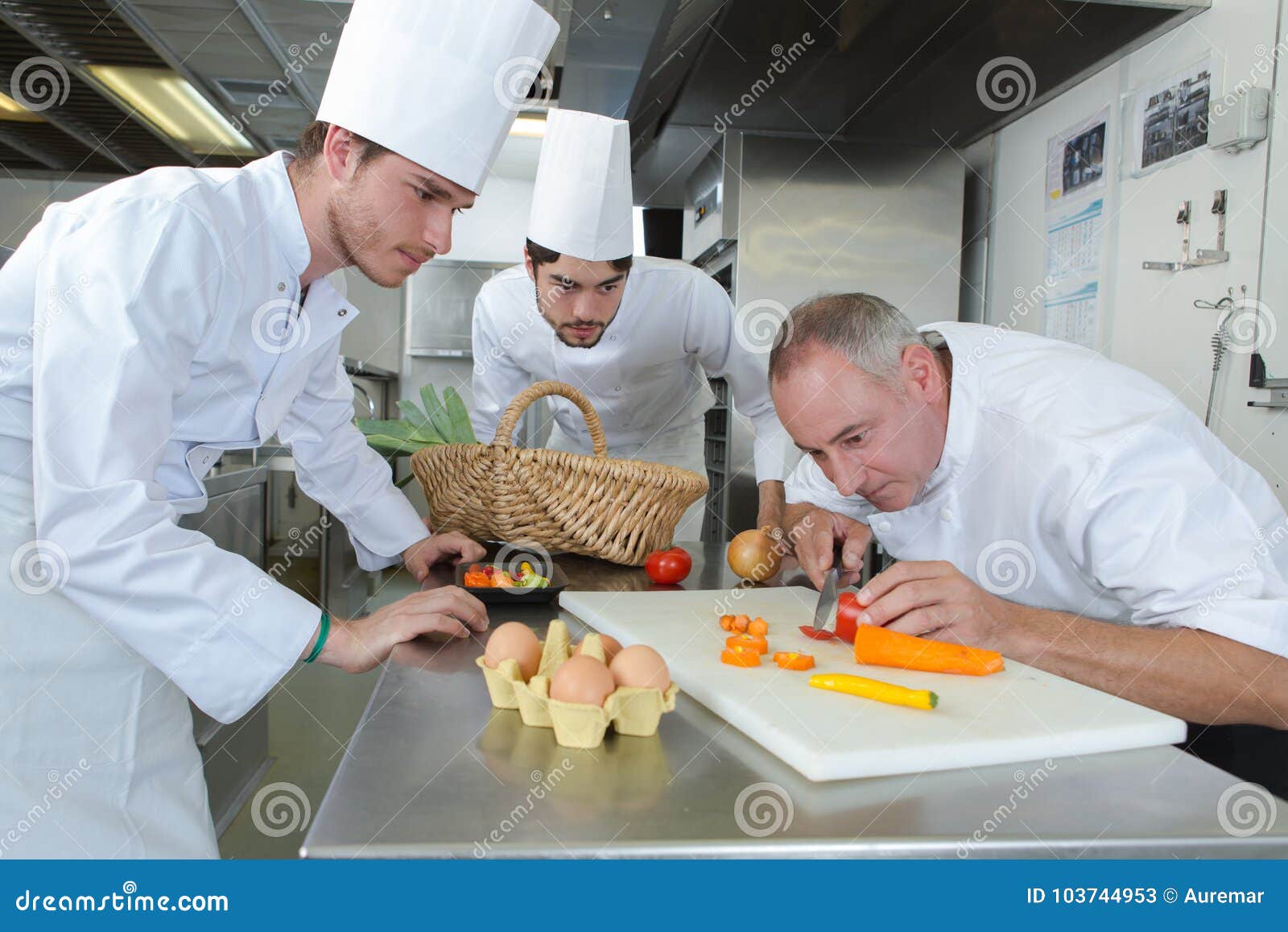 Chef and Apprentices Preparing Food in Kitchen Stock Image - Image of ...
