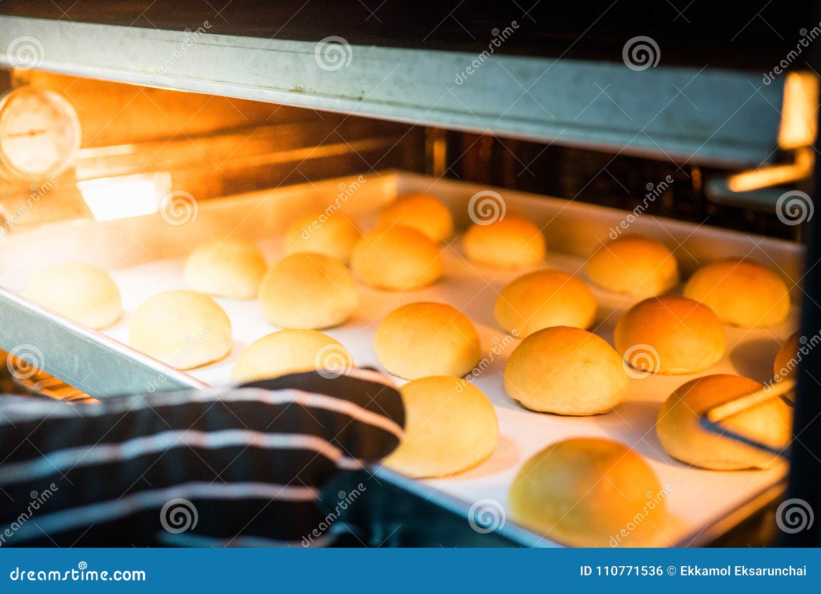 The chef is baking bread. stock photo. Image of business - 110771536