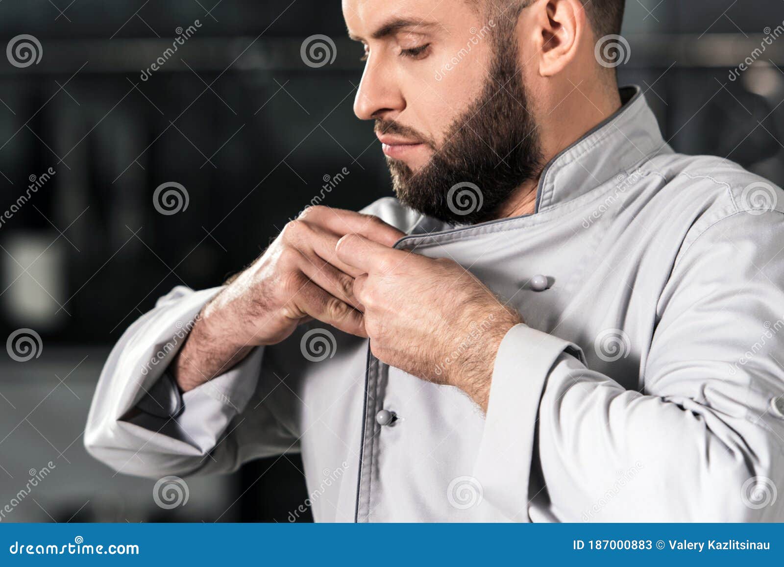 Chef Button Uniform at Kitchen Restaurant. Concentrated Chef Buttoning ...
