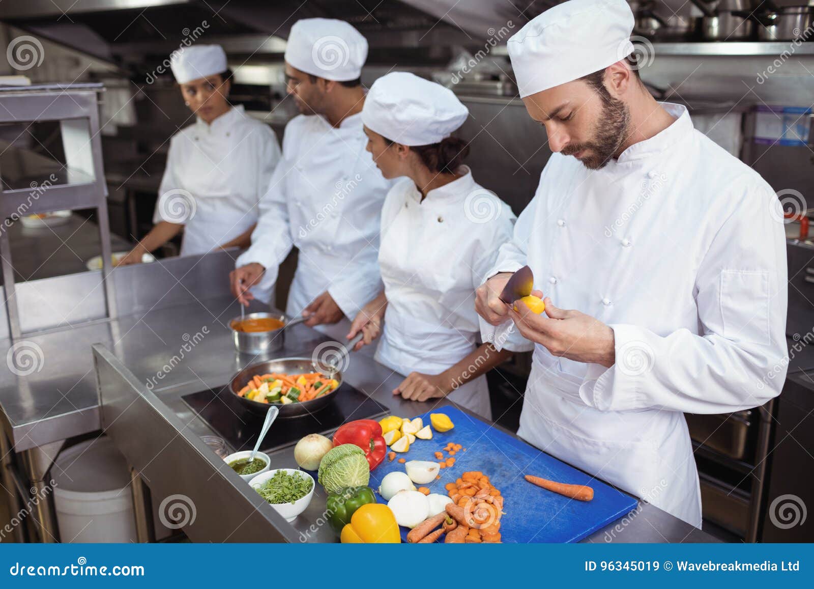 Chef Checking Food from Spoon in Kitchen at Restaurant Stock Image ...