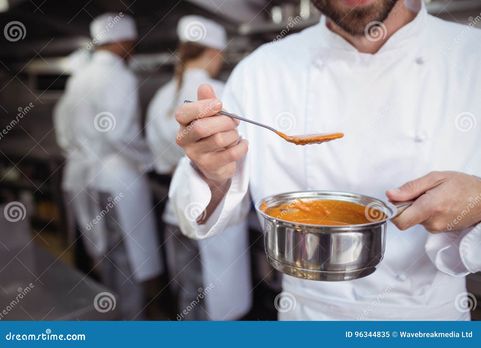 Chef Checking Food from Spoon in Kitchen at Restaurant Stock Image ...