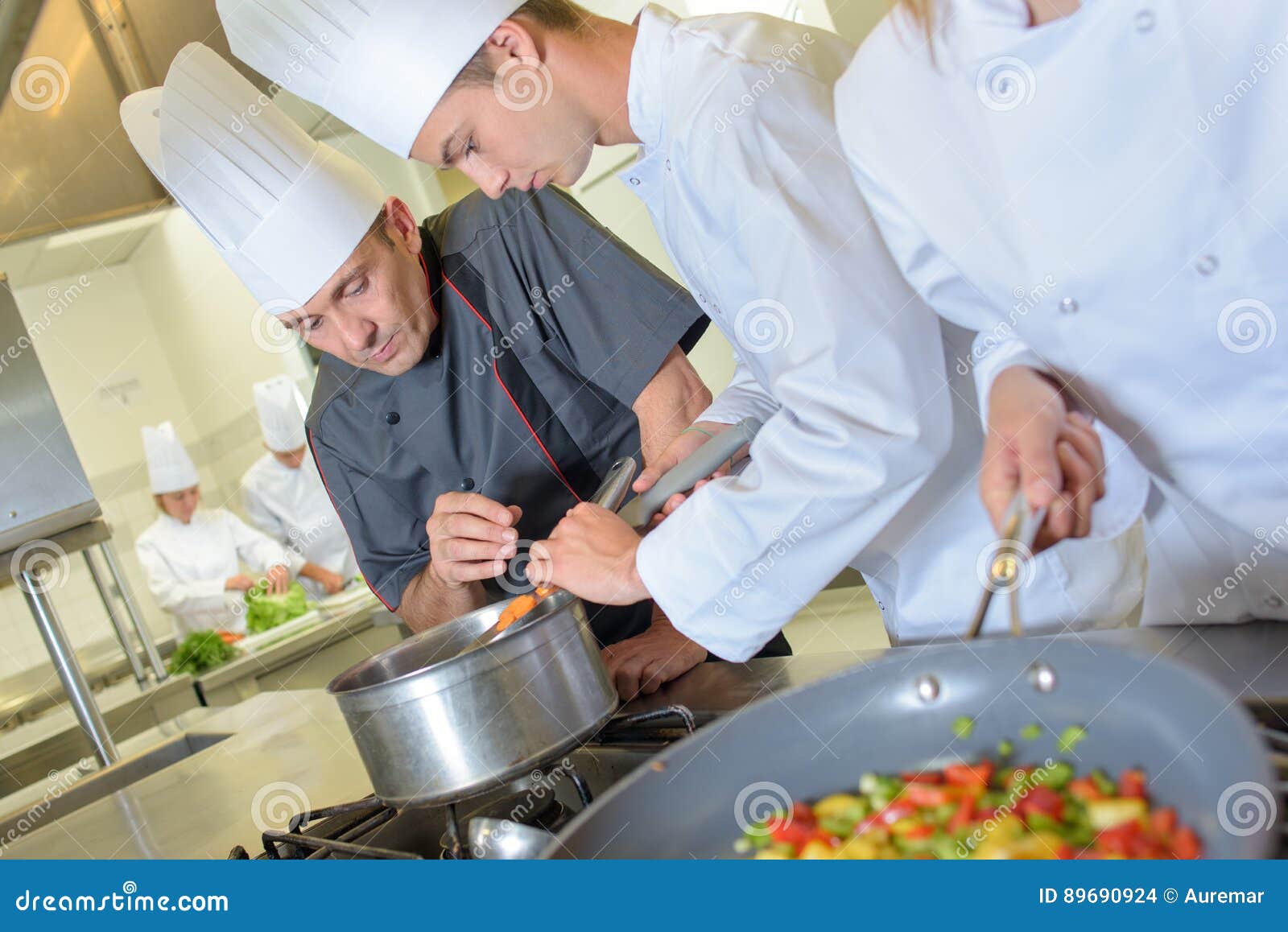 Chef Checking Trainee`s Pan Food Stock Photo - Image of stove, male ...