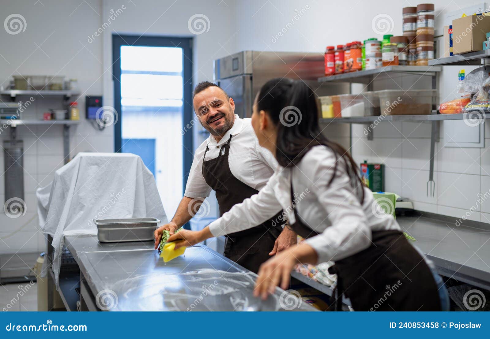Chef and Cook Cleaning the Workspace after Doing Dishes Indoors in ...