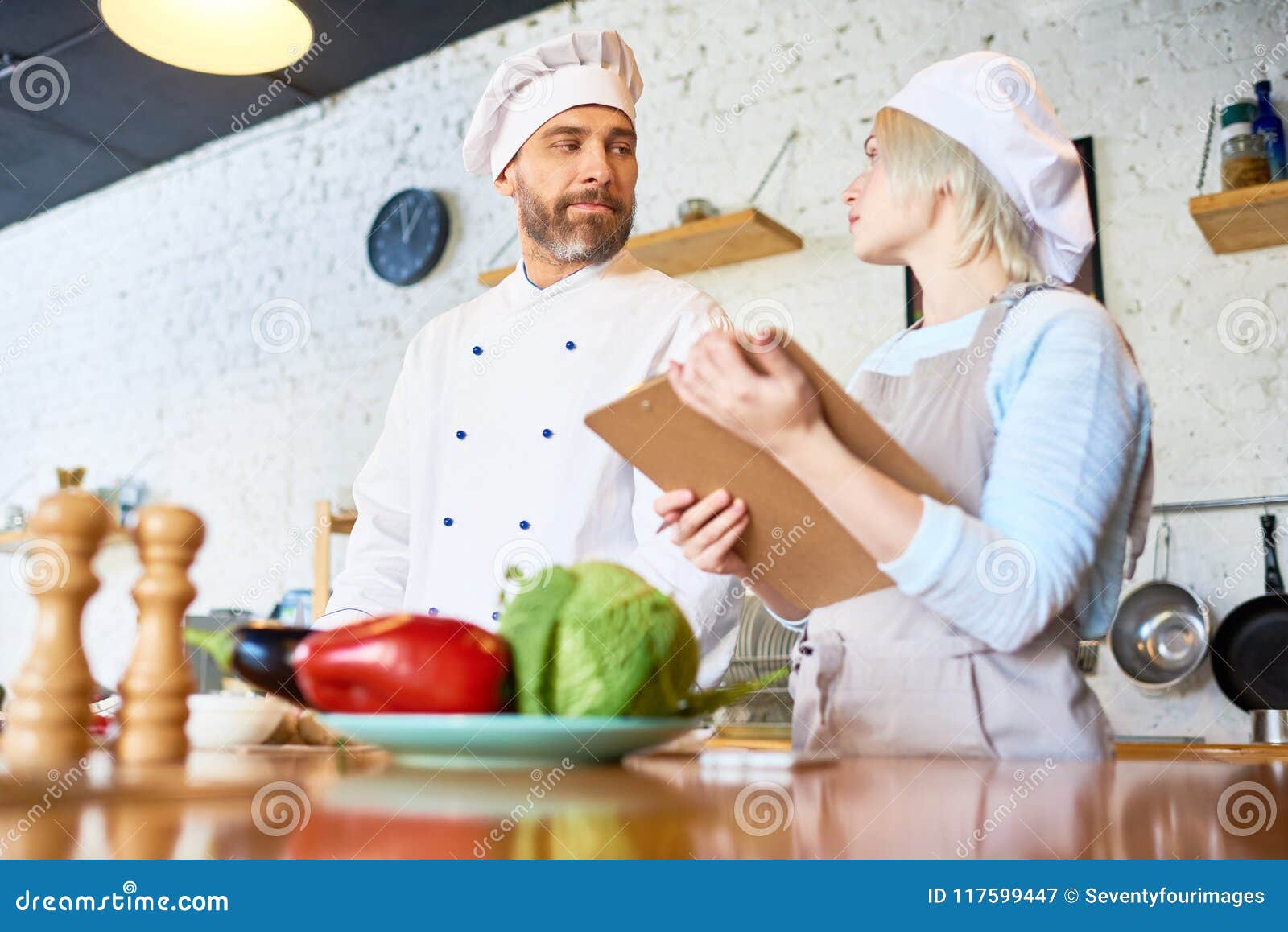 Discussing menu stock image. Image of cook, culinary - 117599447