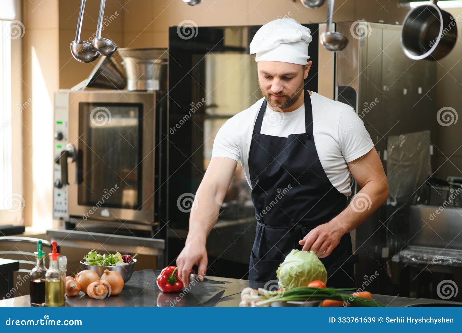 Chef Cook in Uniform Cooking in the Big Cooker at the Restaurant ...