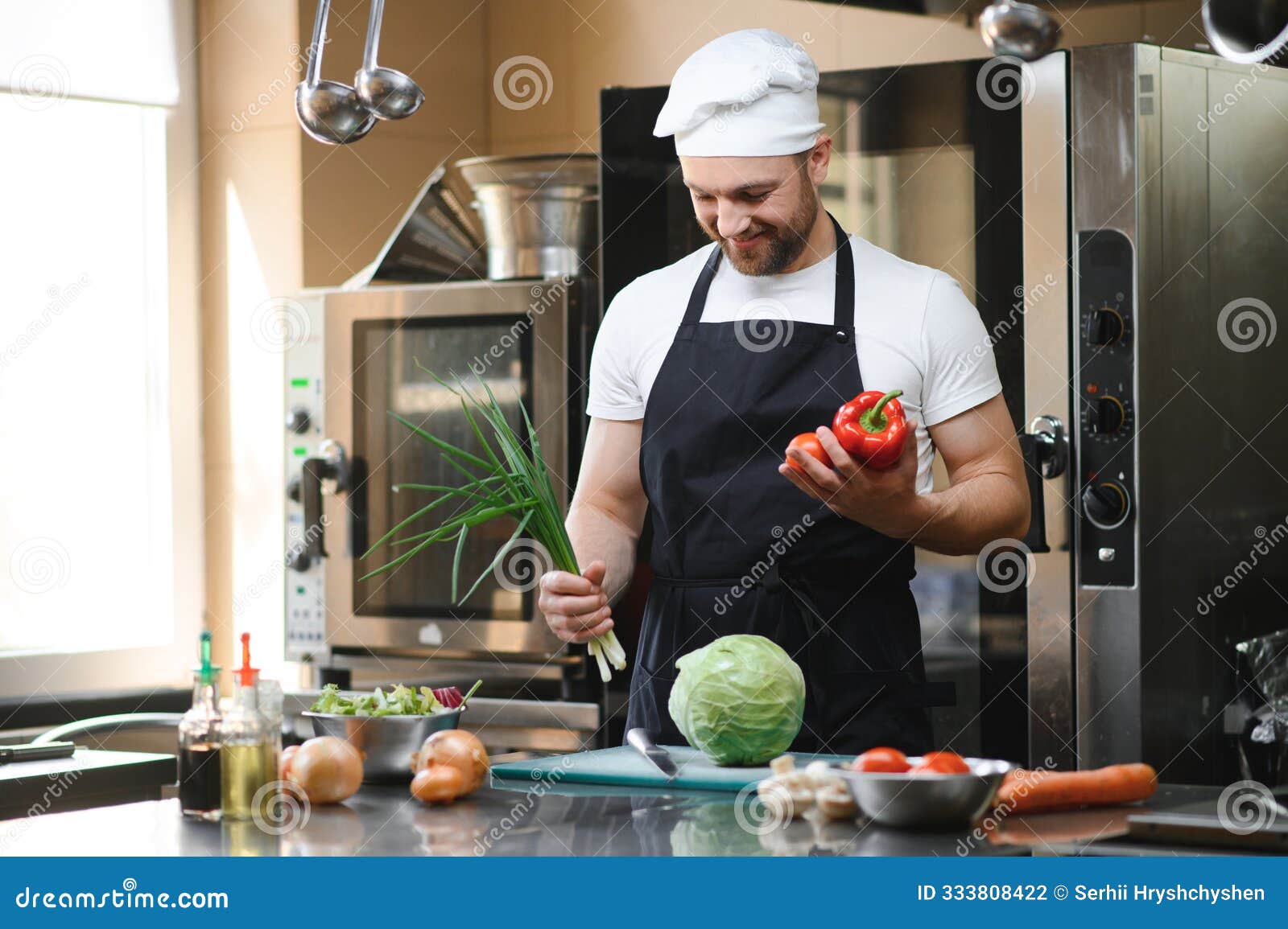 Chef Cook in Uniform Cooking in the Big Cooker at the Restaurant ...