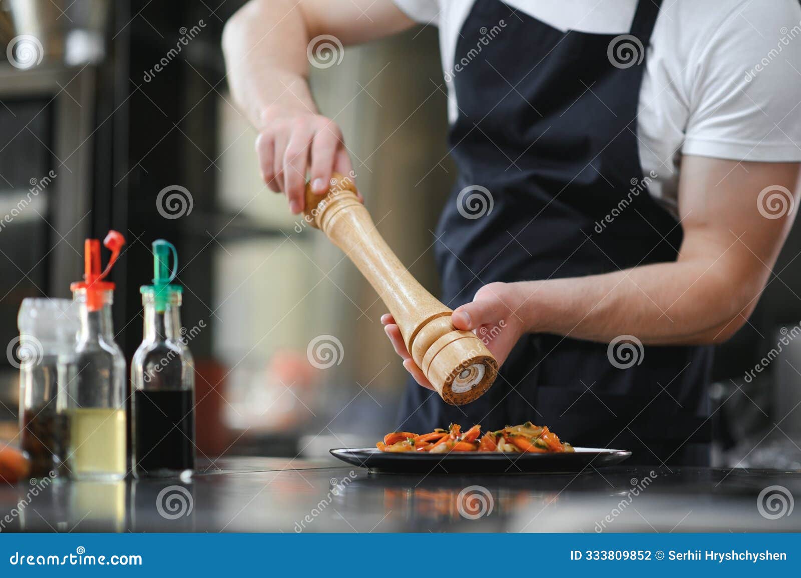 Chef Cook in Uniform Cooking in the Big Cooker at the Restaurant ...