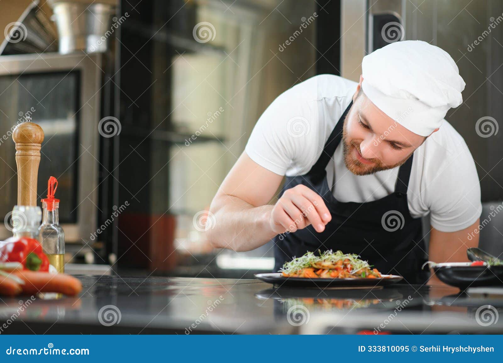 Chef Cook in Uniform Cooking in the Big Cooker at the Restaurant ...