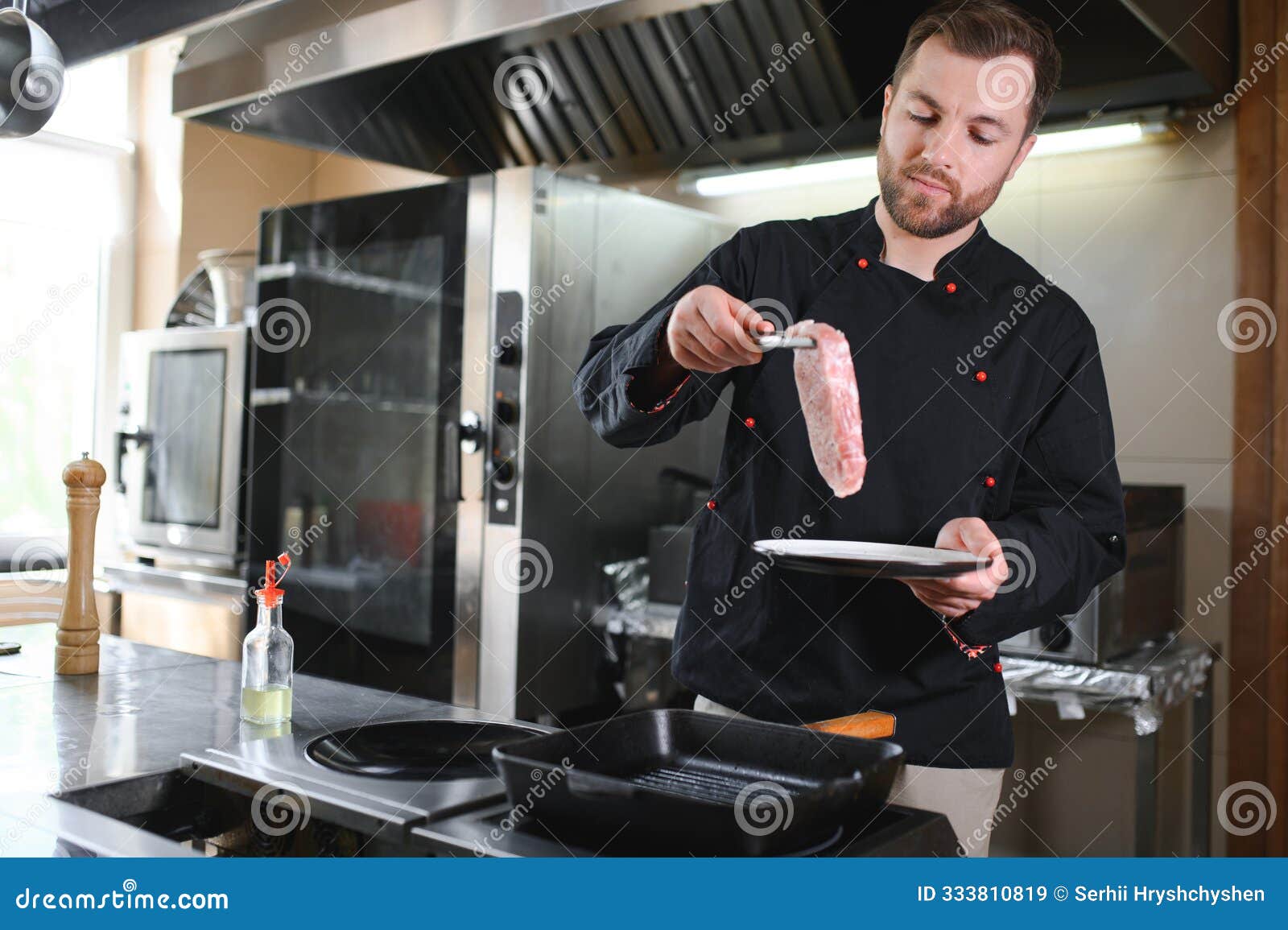 Chef Cook in Uniform Cooking in the Big Cooker at the Restaurant ...