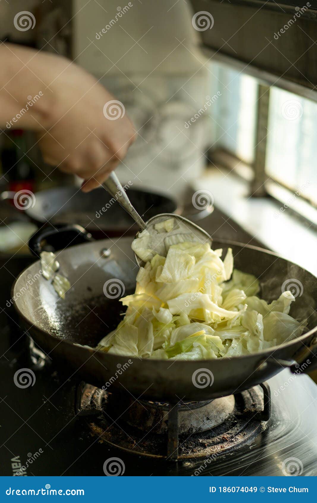 A chef is cooking cabbage stock image. Image of closeup - 186074049
