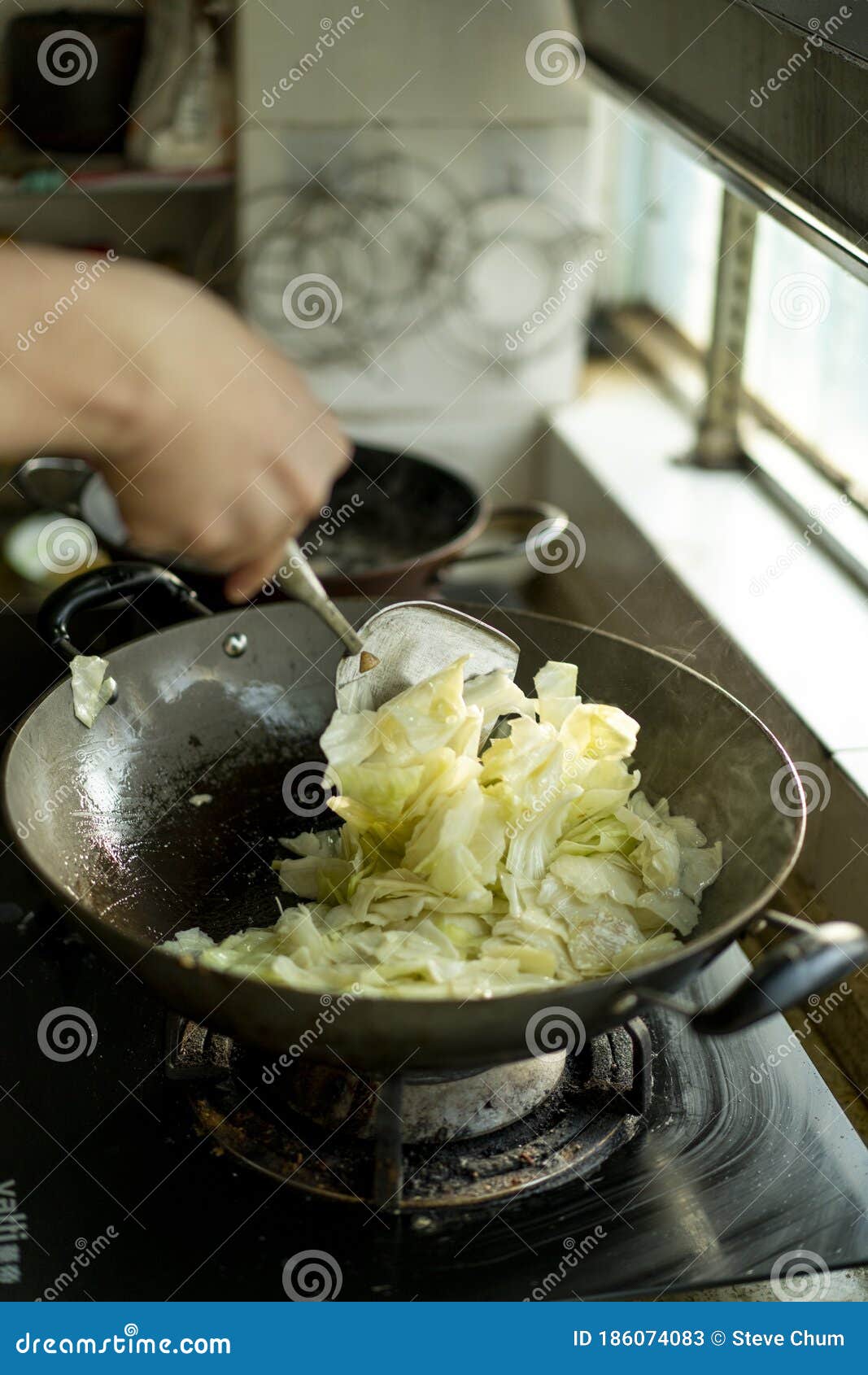 A chef is cooking cabbage stock image. Image of nutrients - 186074083