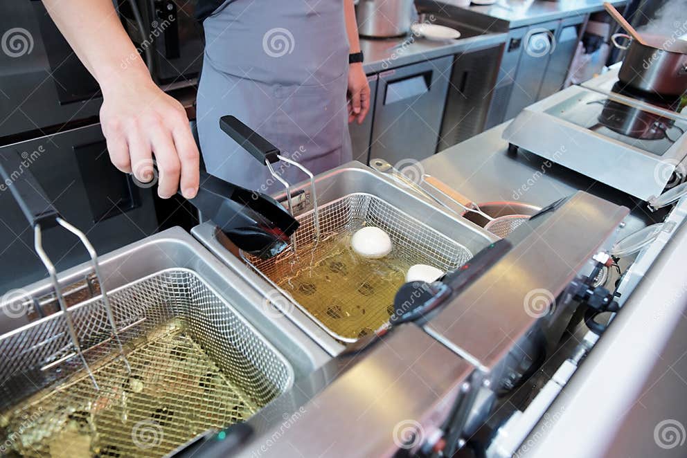 Chef Cooking Dish in a Deep Fryer Stock Image - Image of friture, cook ...