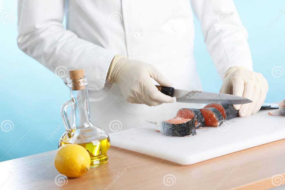 Chef cooking a fish stock image. Image of knee, salmon - 8495273