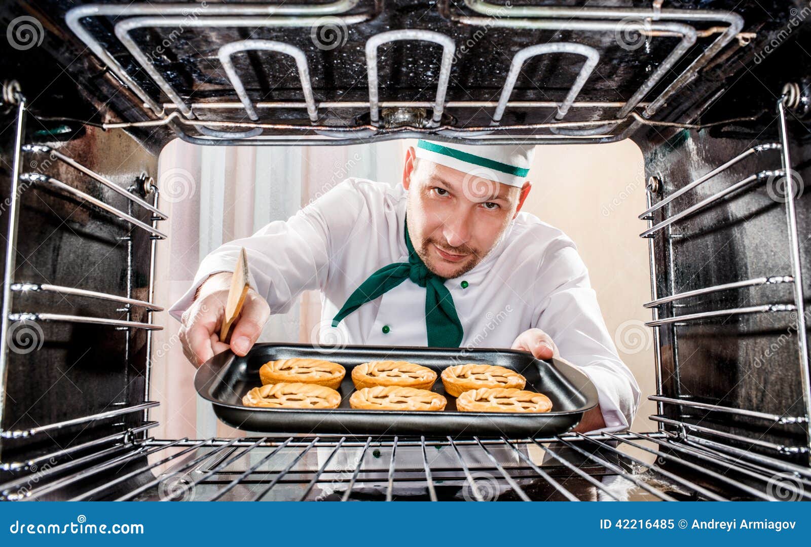 Chef cooking in the oven. stock image. Image of cupcake - 42216485