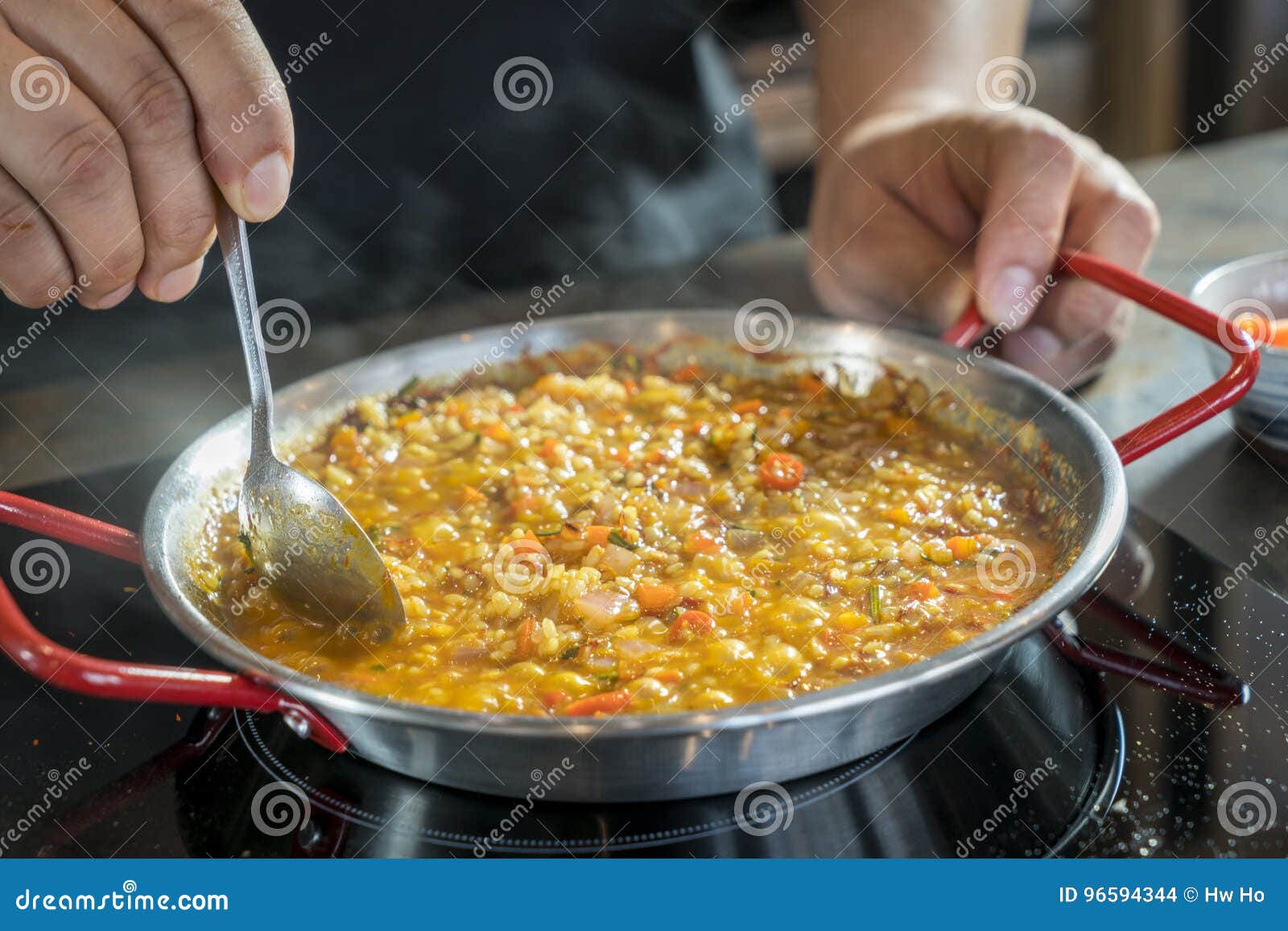 Chef is Cooking Paella with Spoon, Close Up Stock Photo - Image of dark ...