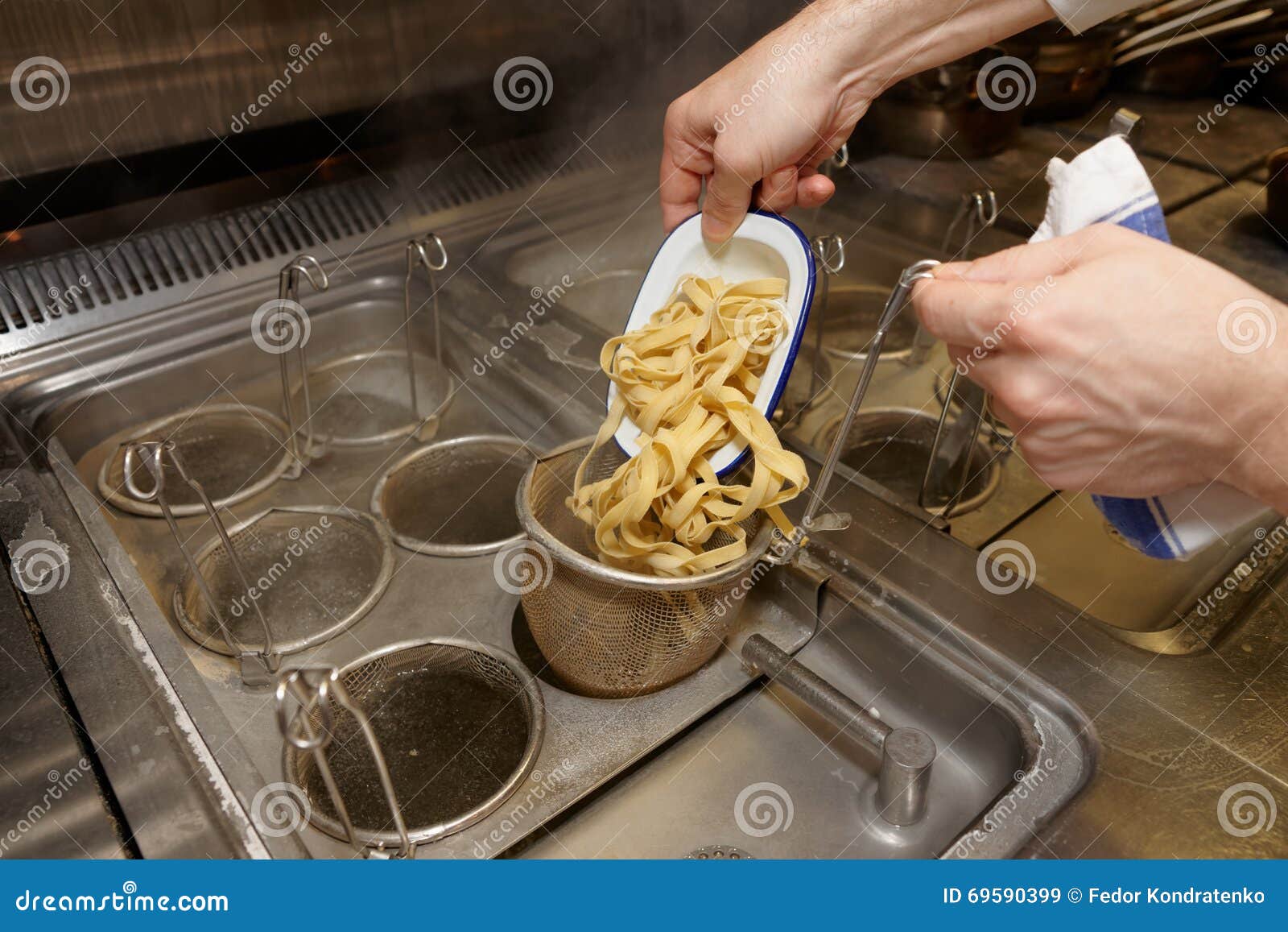 Chef is cooking pasta stock image. Image of pasta, equipment - 69590399