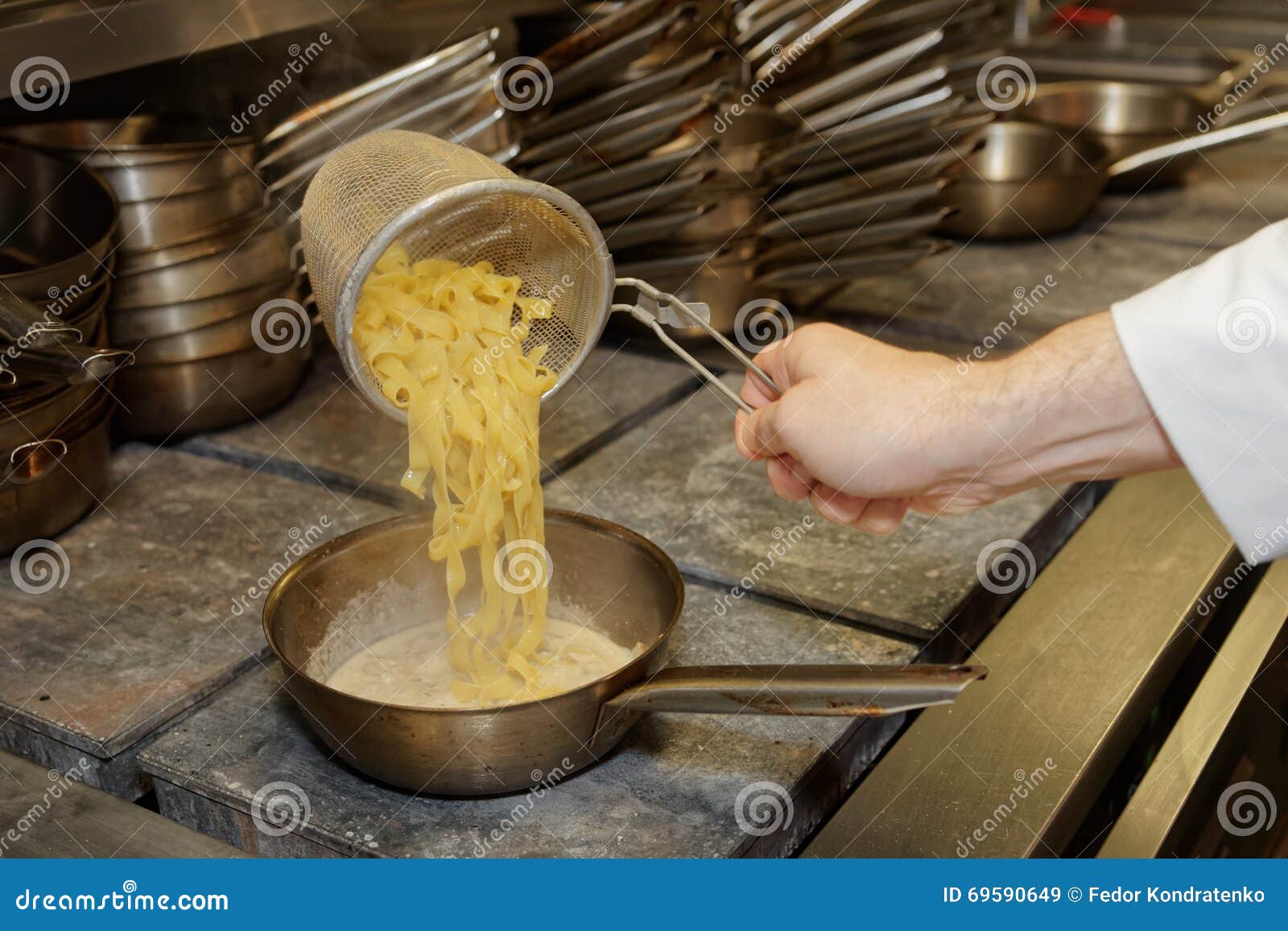 Chef is cooking pasta stock image. Image of catering - 69590649
