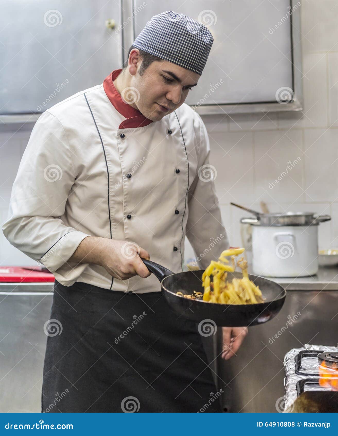 Chef Cooking Pasta stock photo. Image of adult, meal - 64910808