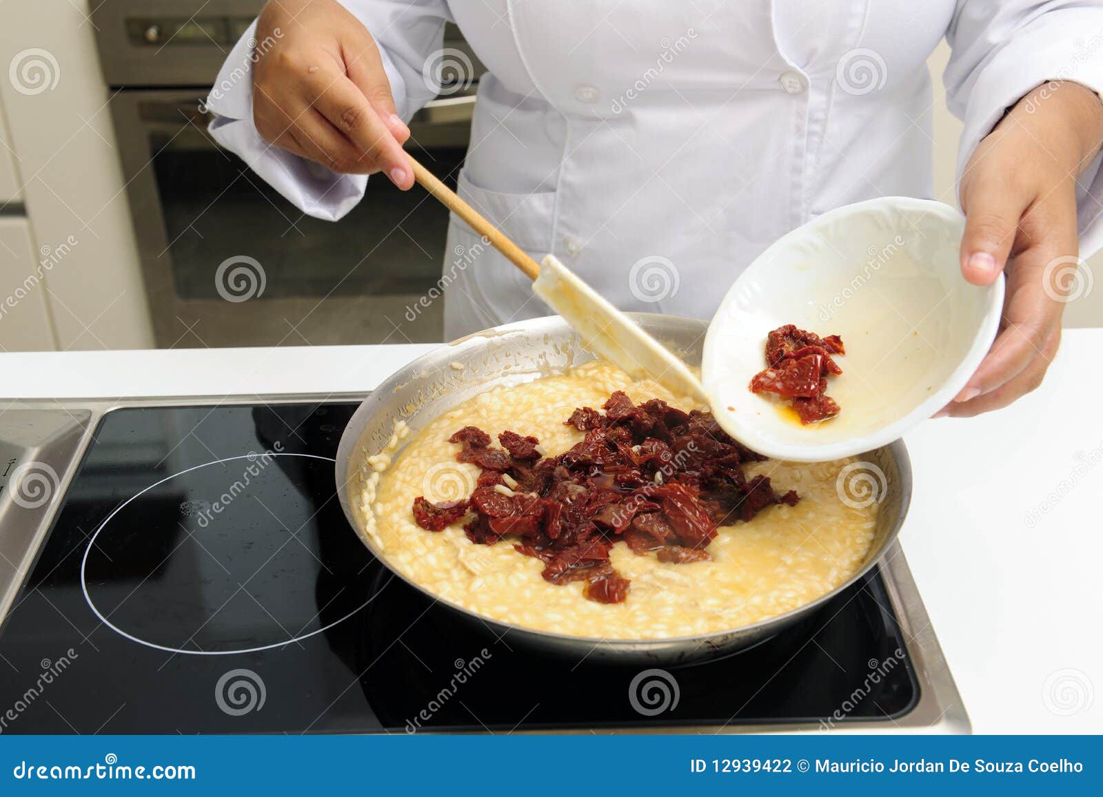 Chef cooking risotto stock photo. Image of anonymous - 12939422