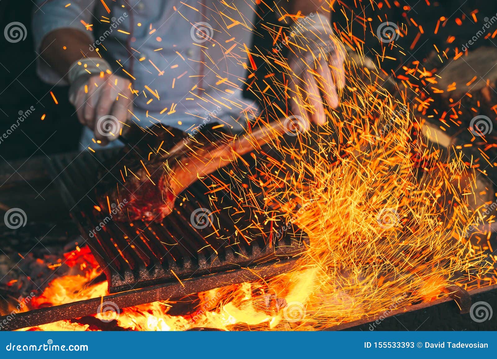 Chef Cooking Steak. Cook Turns the Meat on the Fire. Stock Image ...