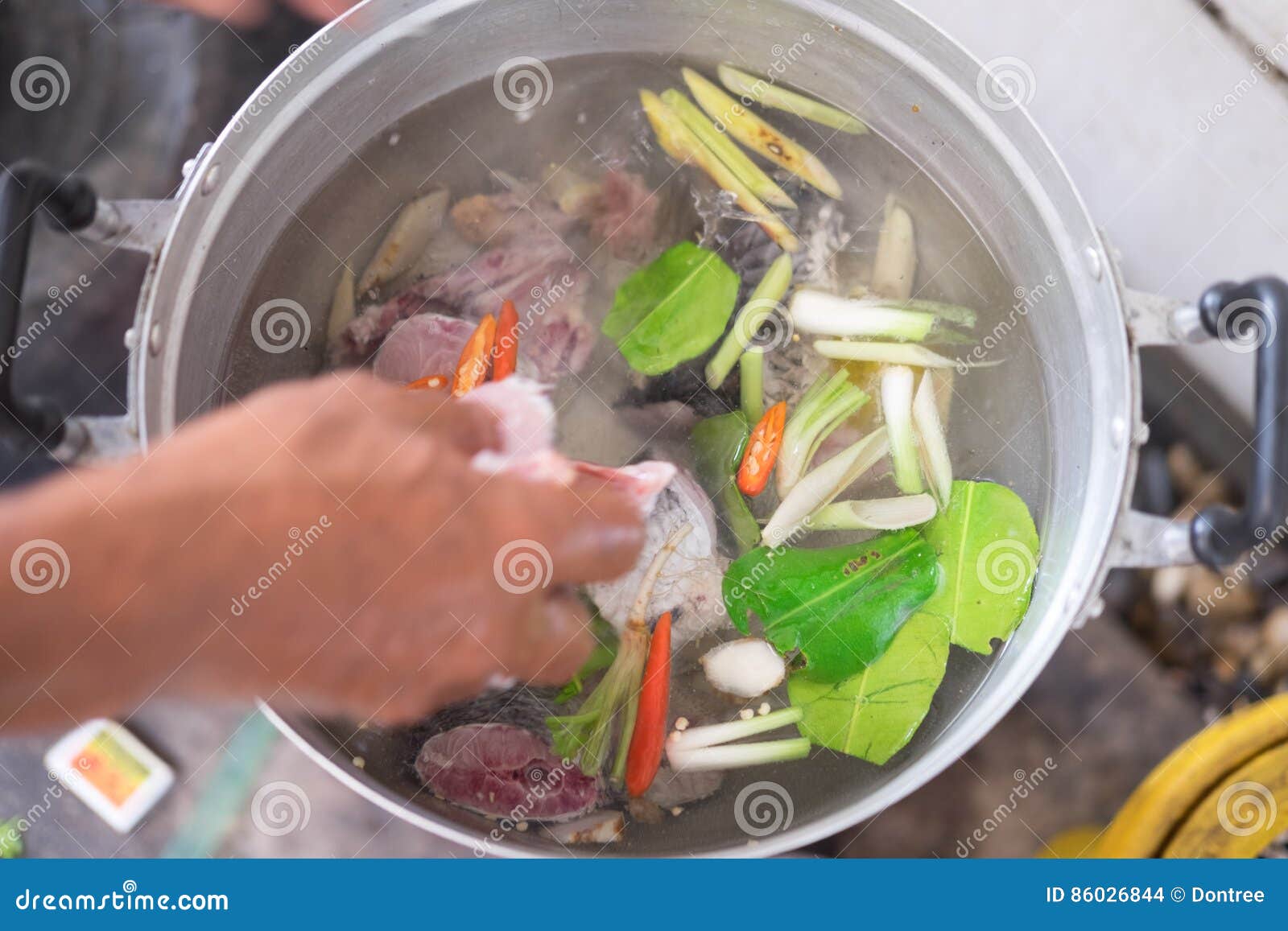 Chef cooking Tom Yam Fish stock photo. Image of nature - 86026844