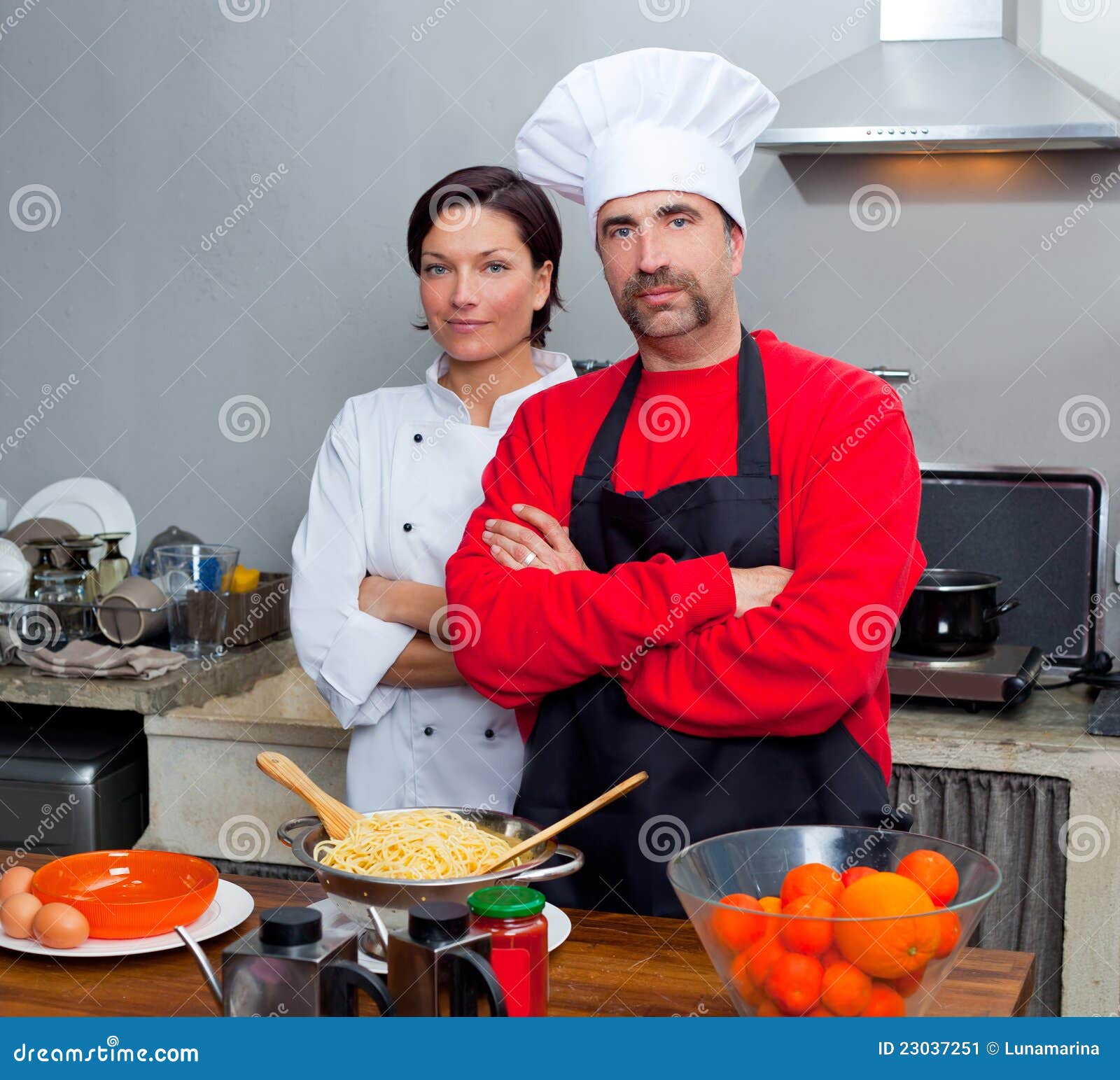 Chef Couple Man and Woman Posing in Kitchen Stock Image - Image of ...