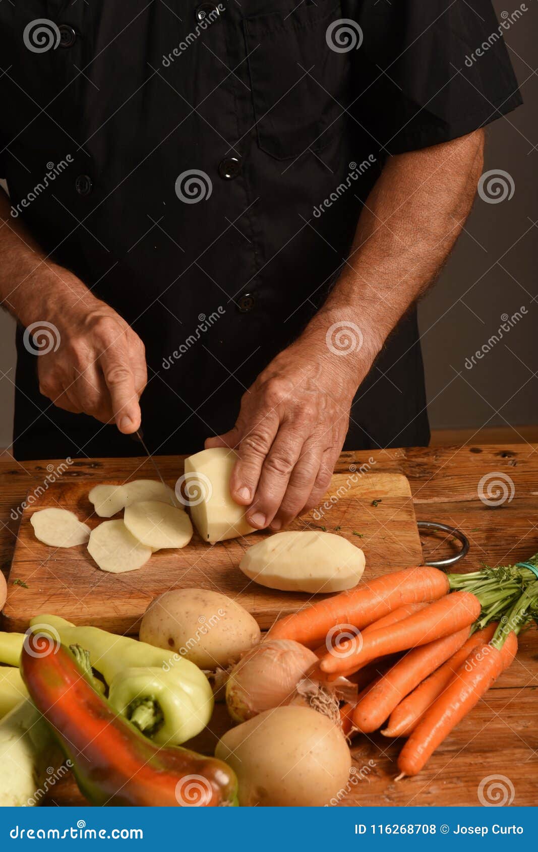 A Chef Cut Potato on a Wooden Stock Photo - Image of black, potato ...
