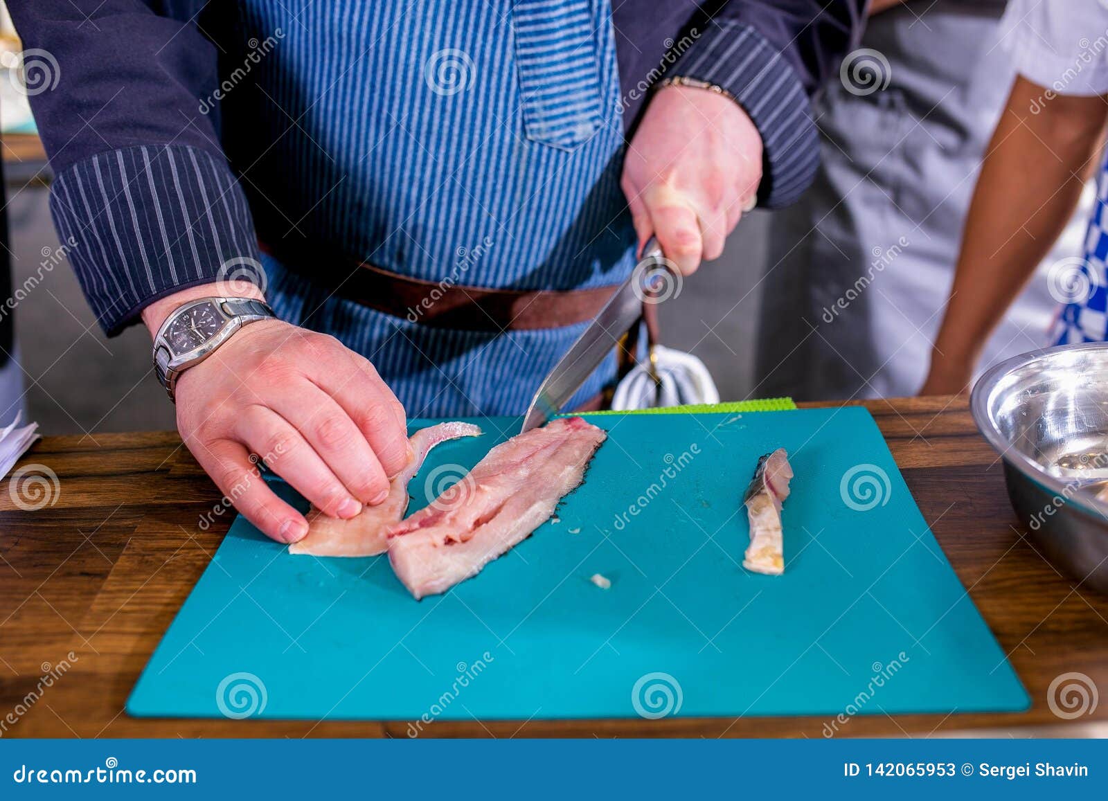 Chef Cuts Fish into Pieces. Master Class in the Kitchen. the Process of ...