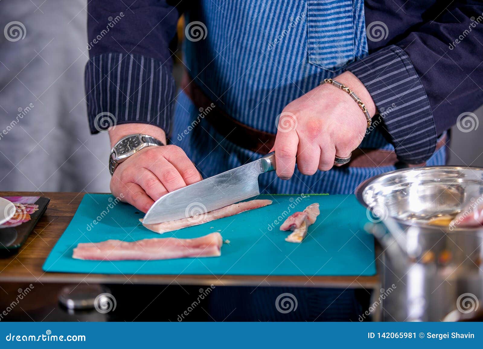 Chef Cuts Fish into Pieces. Master Class in the Kitchen. the Process of ...