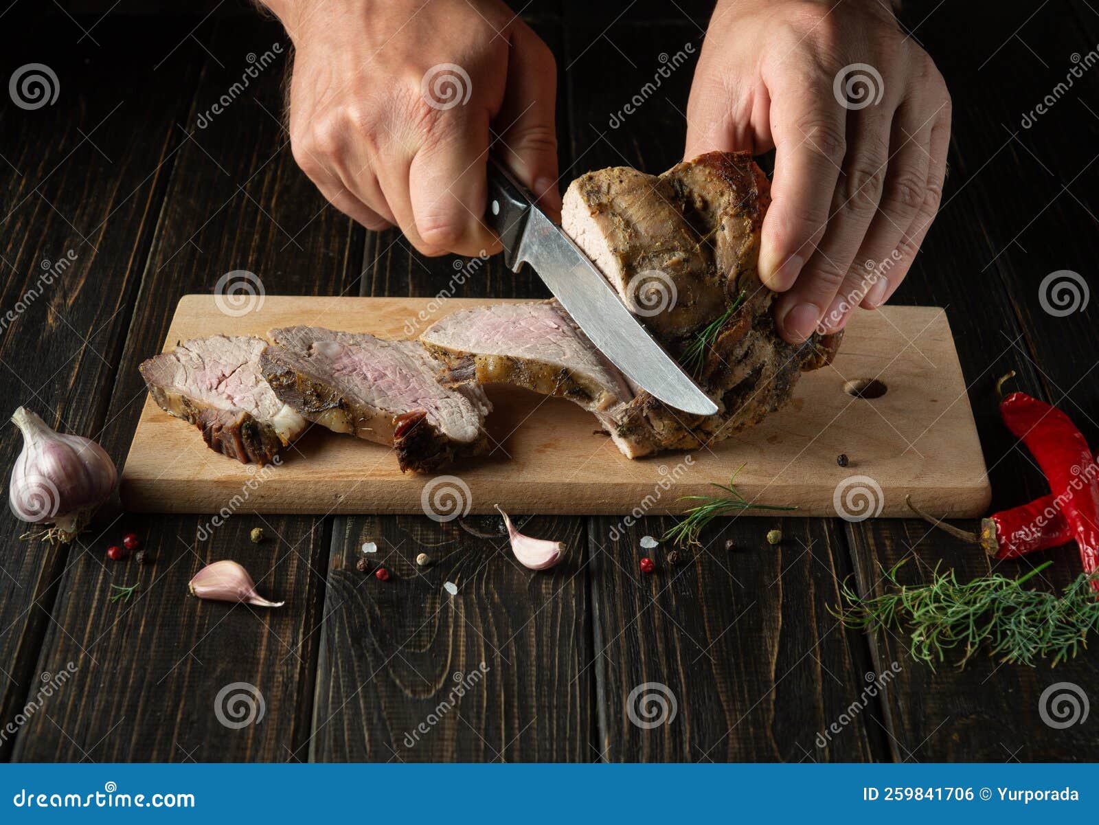 The Chef Cuts the Grilled Veal Meat into Small Slices. Work Environment ...