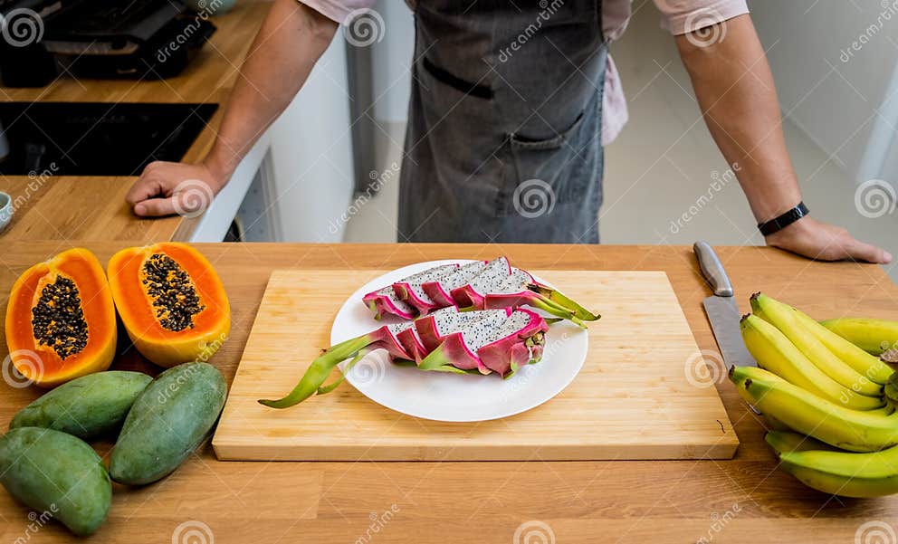 Chef Cuts and Peels Dragon Fruit on the Cutting Board Stock Image ...