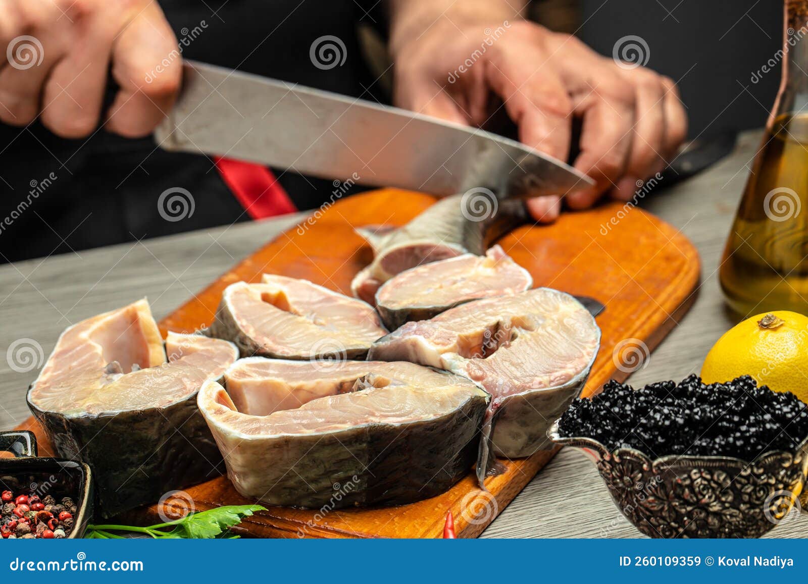 The Chef Cuts Steaks of Large Raw Sturgeon, Culinary, Cooking, Bakery ...