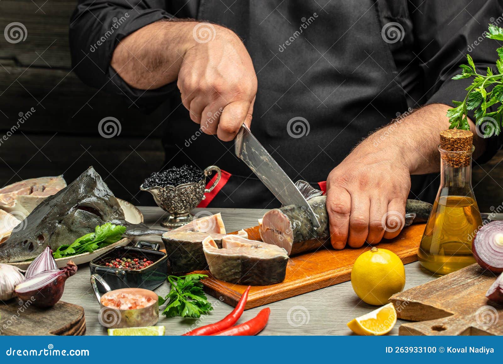 The Chef Cuts Steaks of Large Raw Sturgeon, Culinary, Cooking, Bakery ...