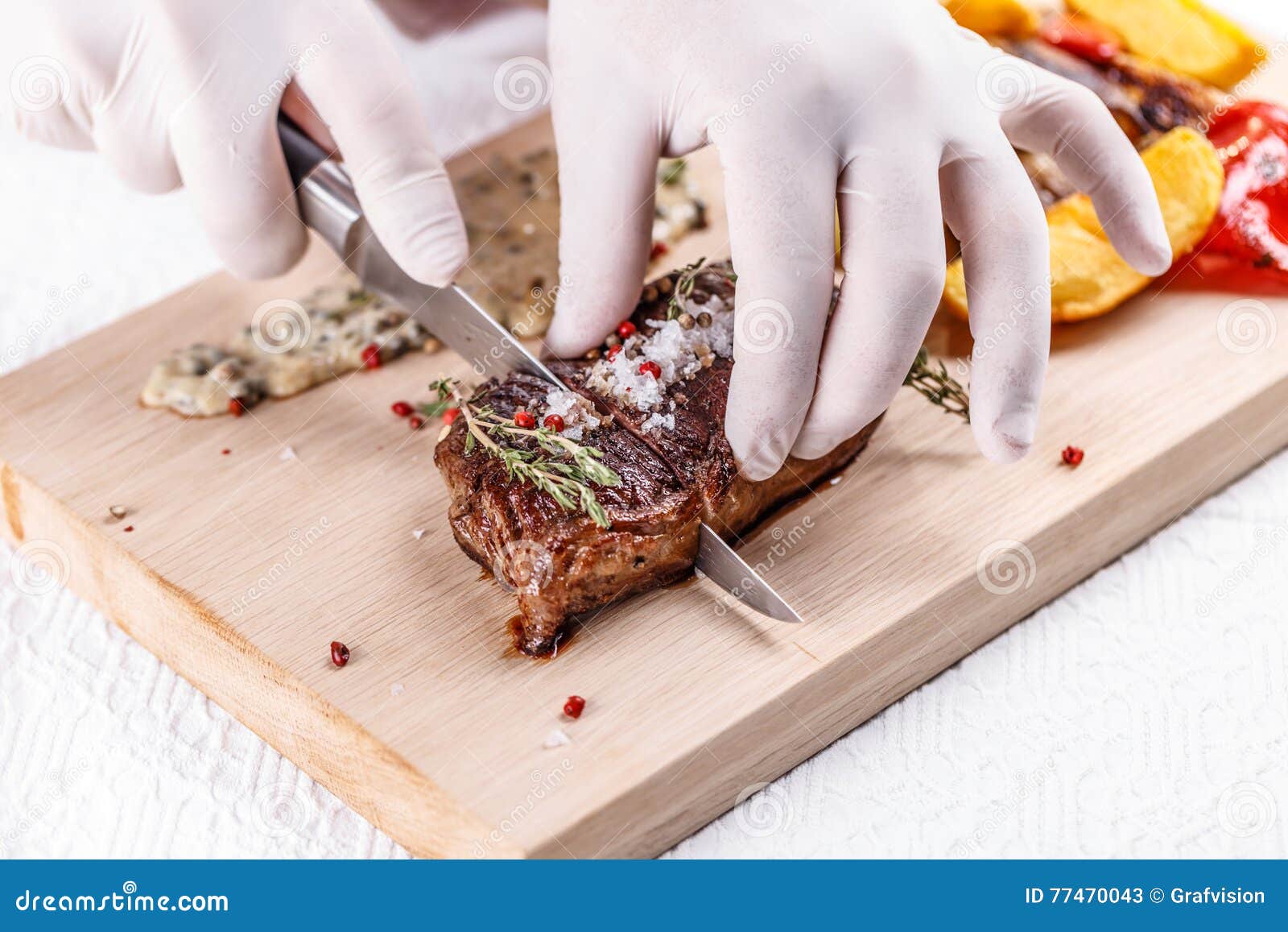 Chef cutting beef steak stock image. Image of commercial - 77470043