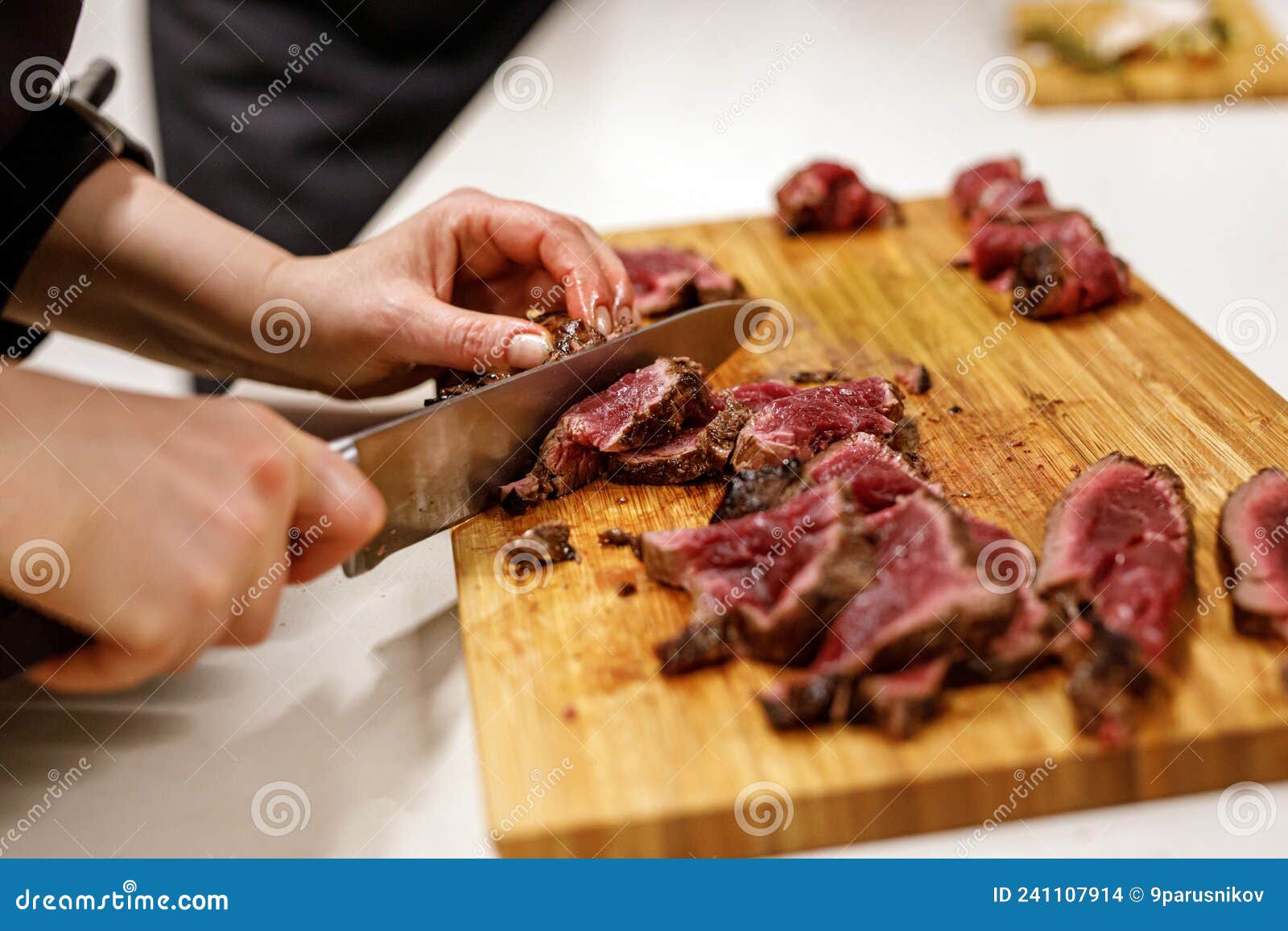 Chef Cutting Beef on a Wooden Desk. Stock Photo - Image of board, roast ...